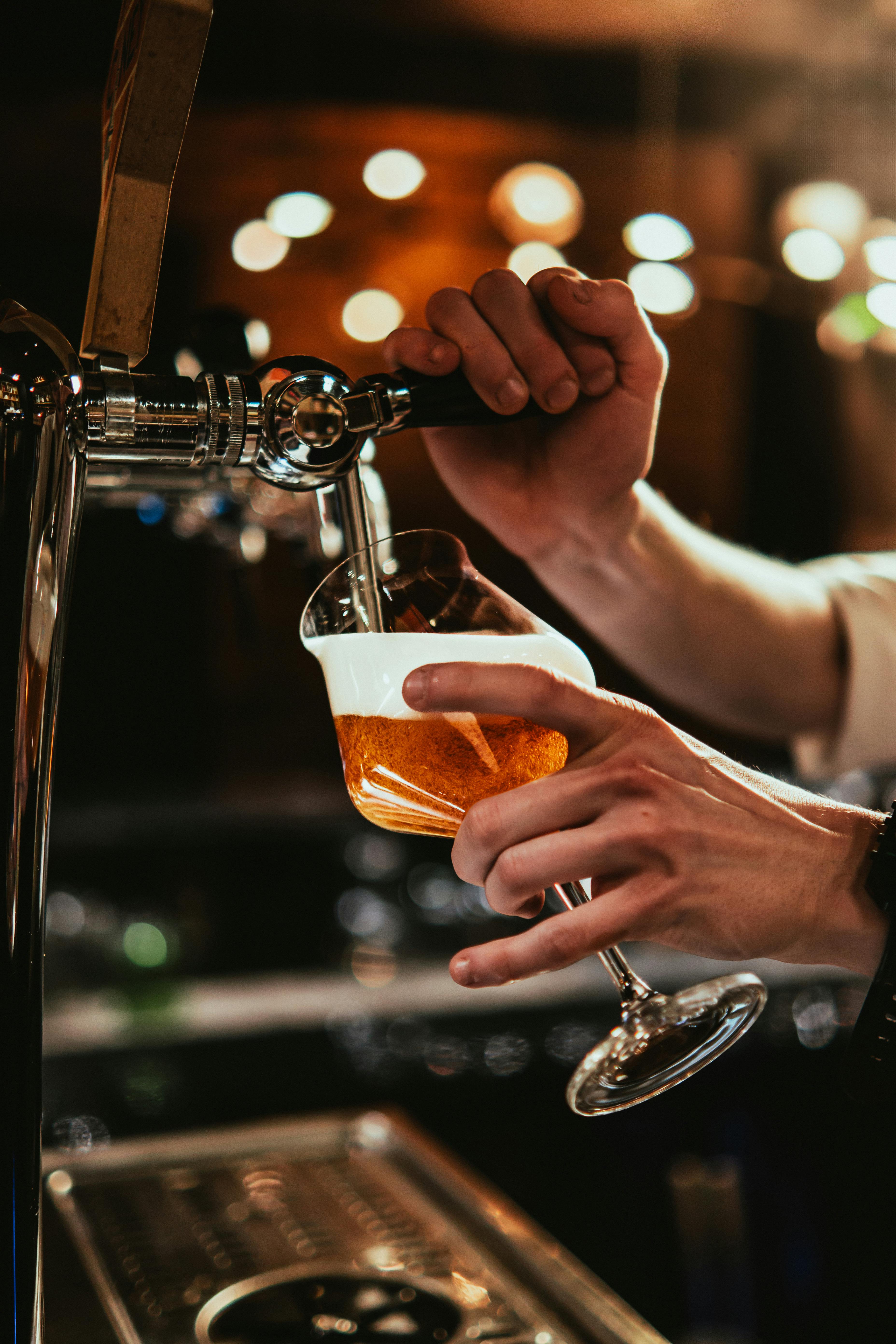 Pouring Draft Beer in a Cozy French Bar · Free Stock Photo