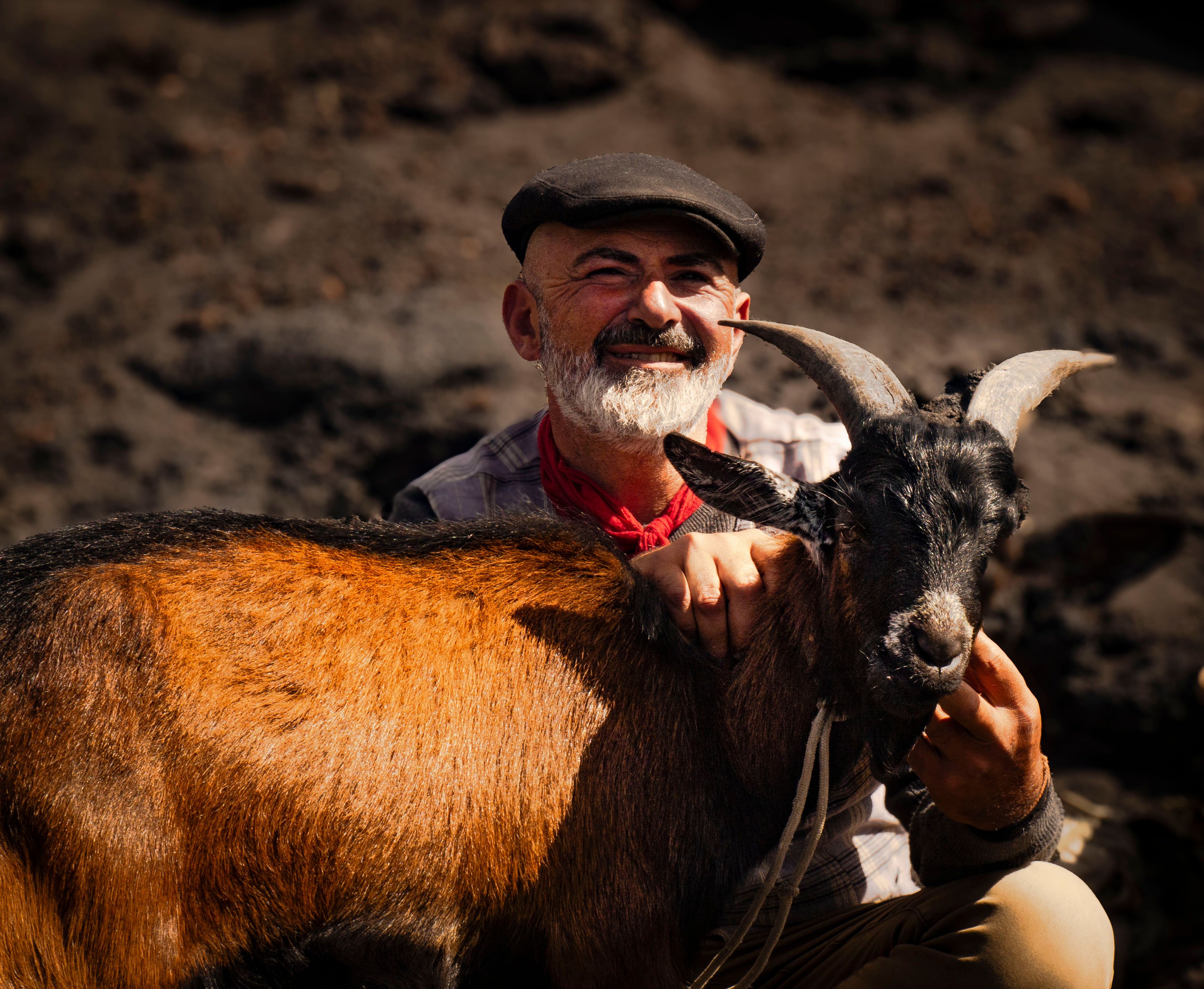 Sicilian Farmer with Goat on Rural Landscape · Free Stock Photo