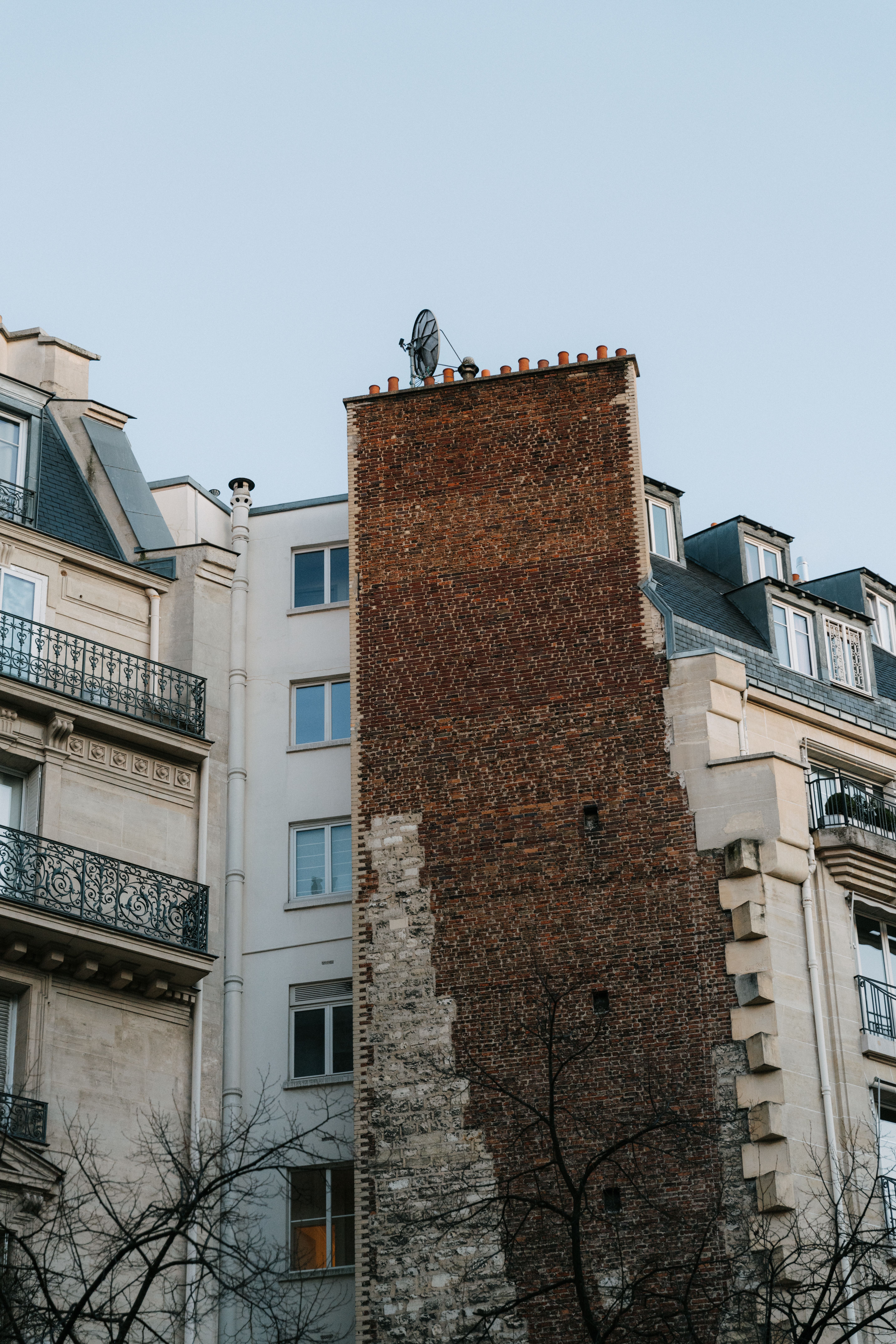 Historic Brick Facade in Paris Architecture · Free Stock Photo