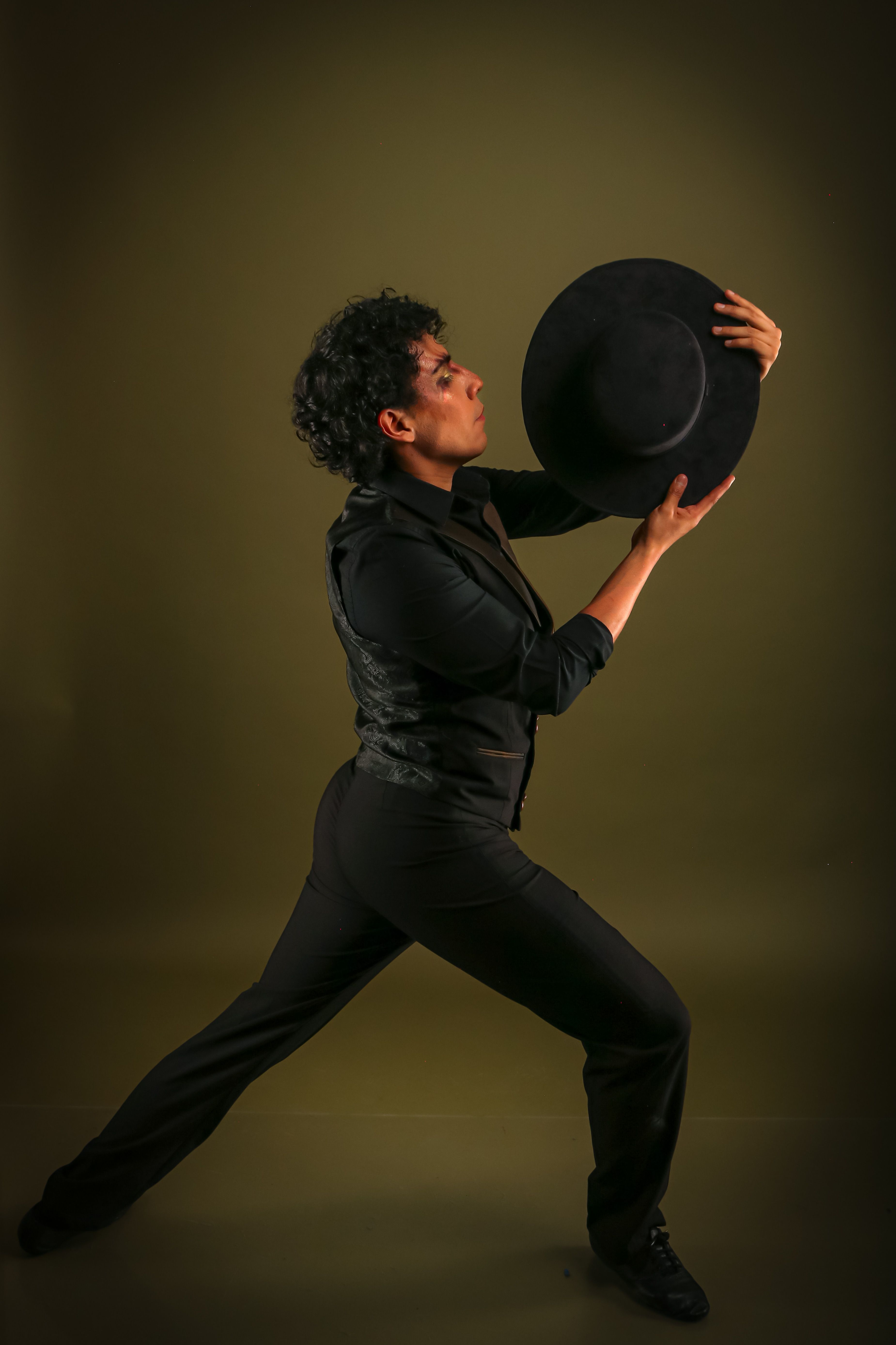 Elegant Dancer Posing with Black Hat in Studio · Free Stock Photo