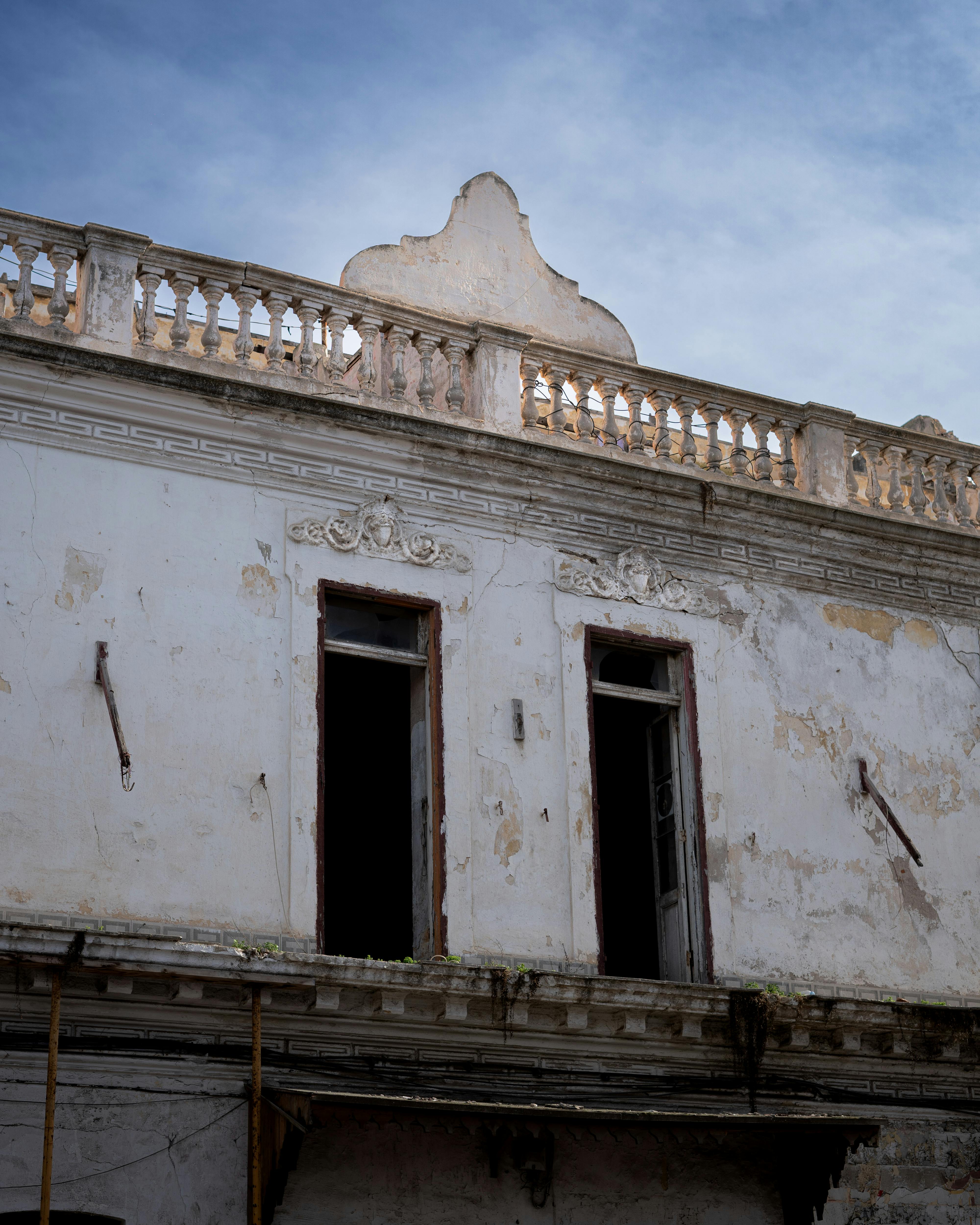 Abandoned Historic Building Facade Under Blue Sky · Free Stock Photo