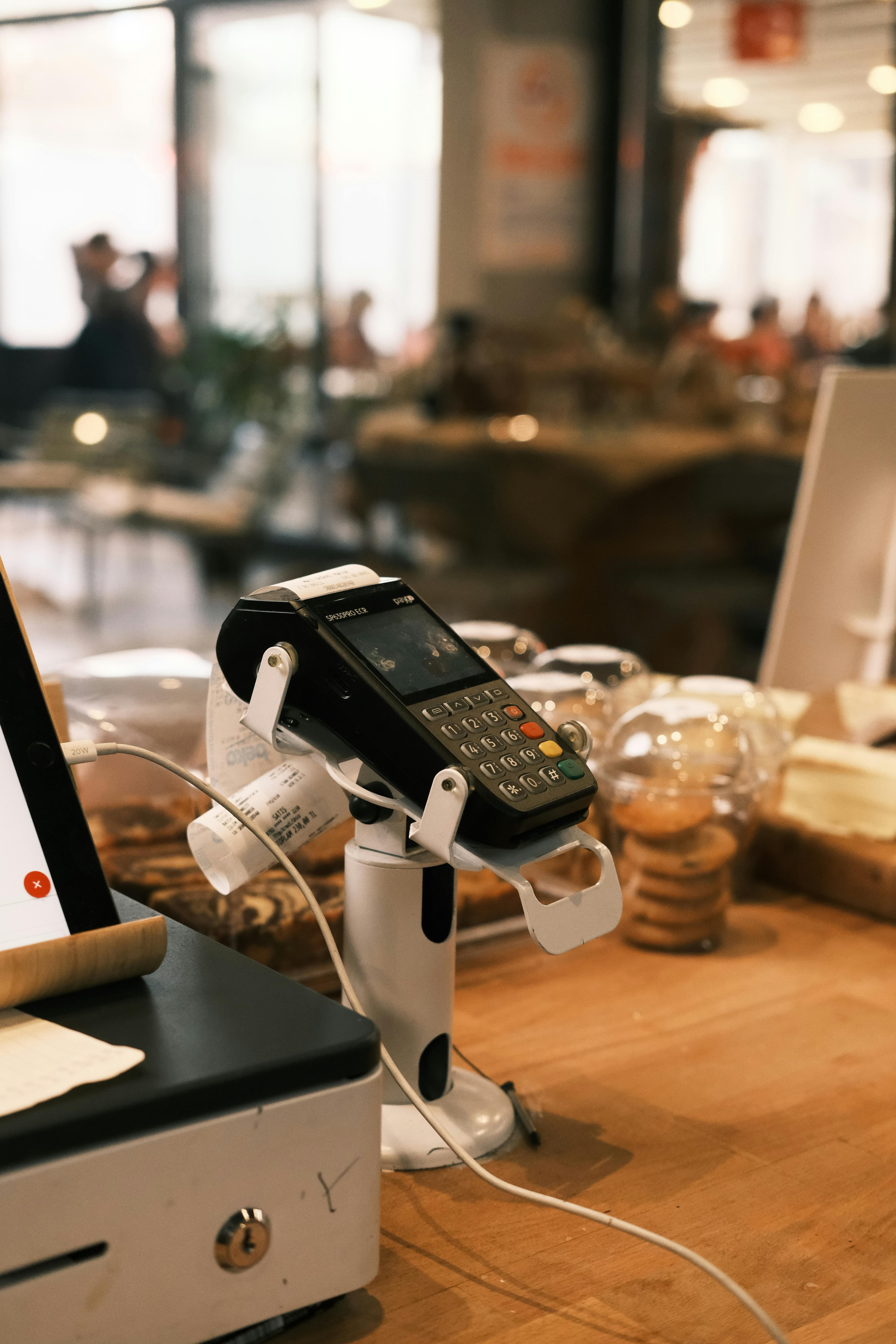 Modern Café Counter with Digital Payment Terminal · Free Stock Photo