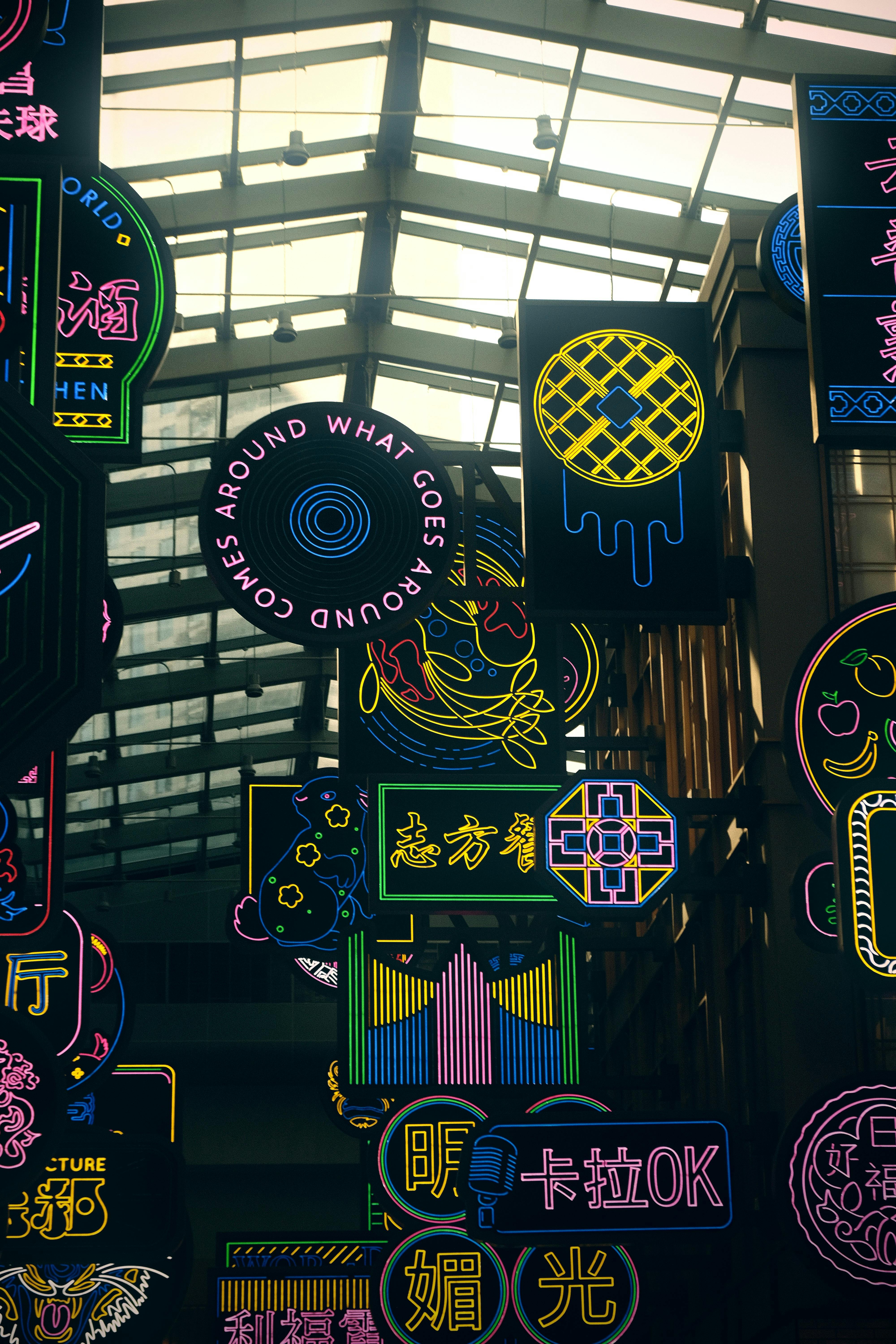 Vibrant Neon Signs in Modern Urban Setting · Free Stock Photo