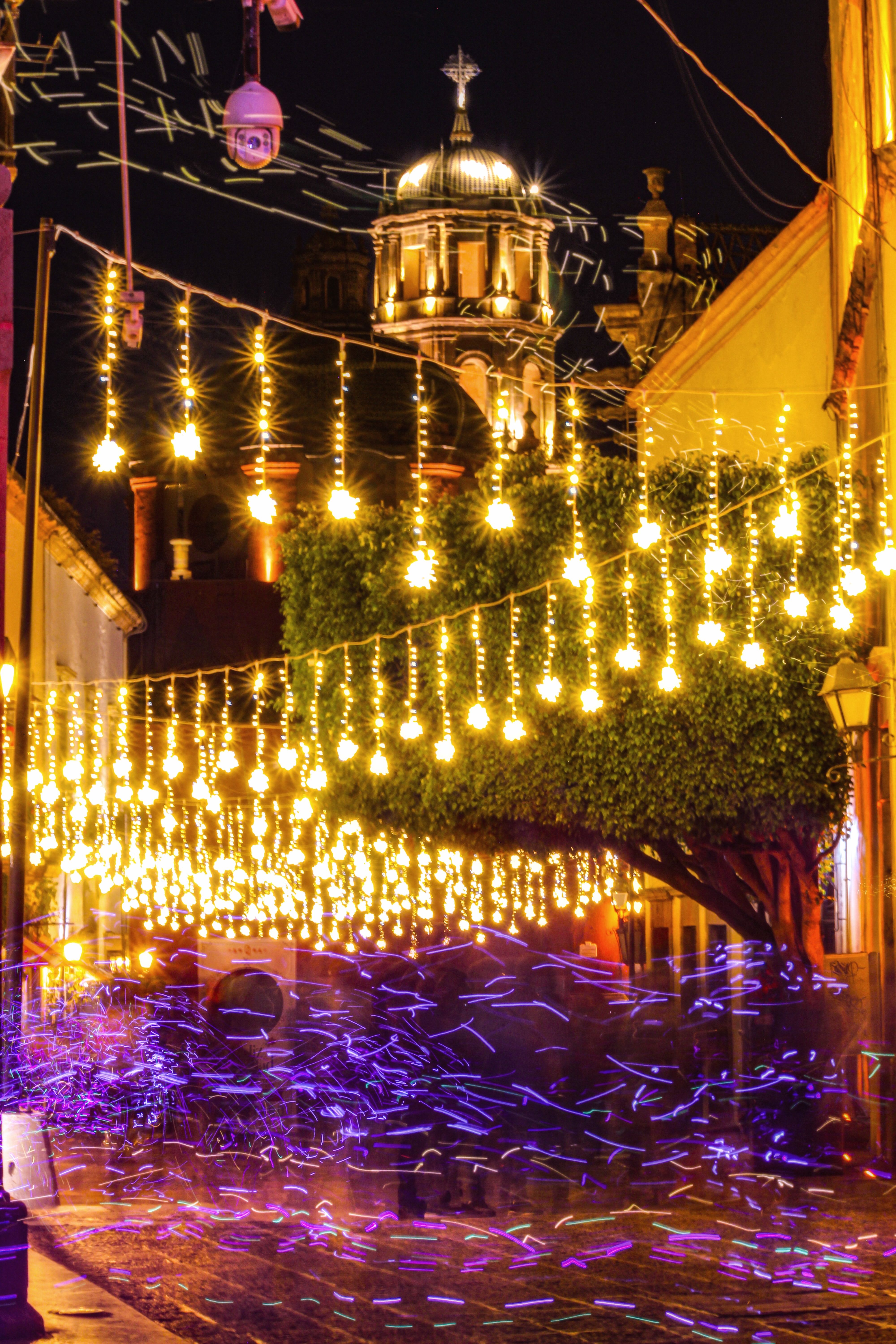 Vibrant Night Scene with Festive Lights Display · Free Stock Photo