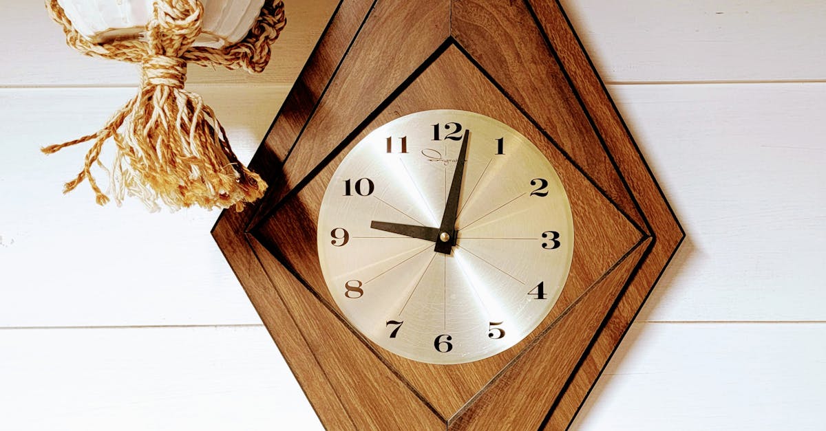 Elegant Wooden Wall Clock with Hanging Plant Decor · Free Stock Photo Elegant Wooden Wall Clock with Hanging Plant Decor · Free Stock Photo