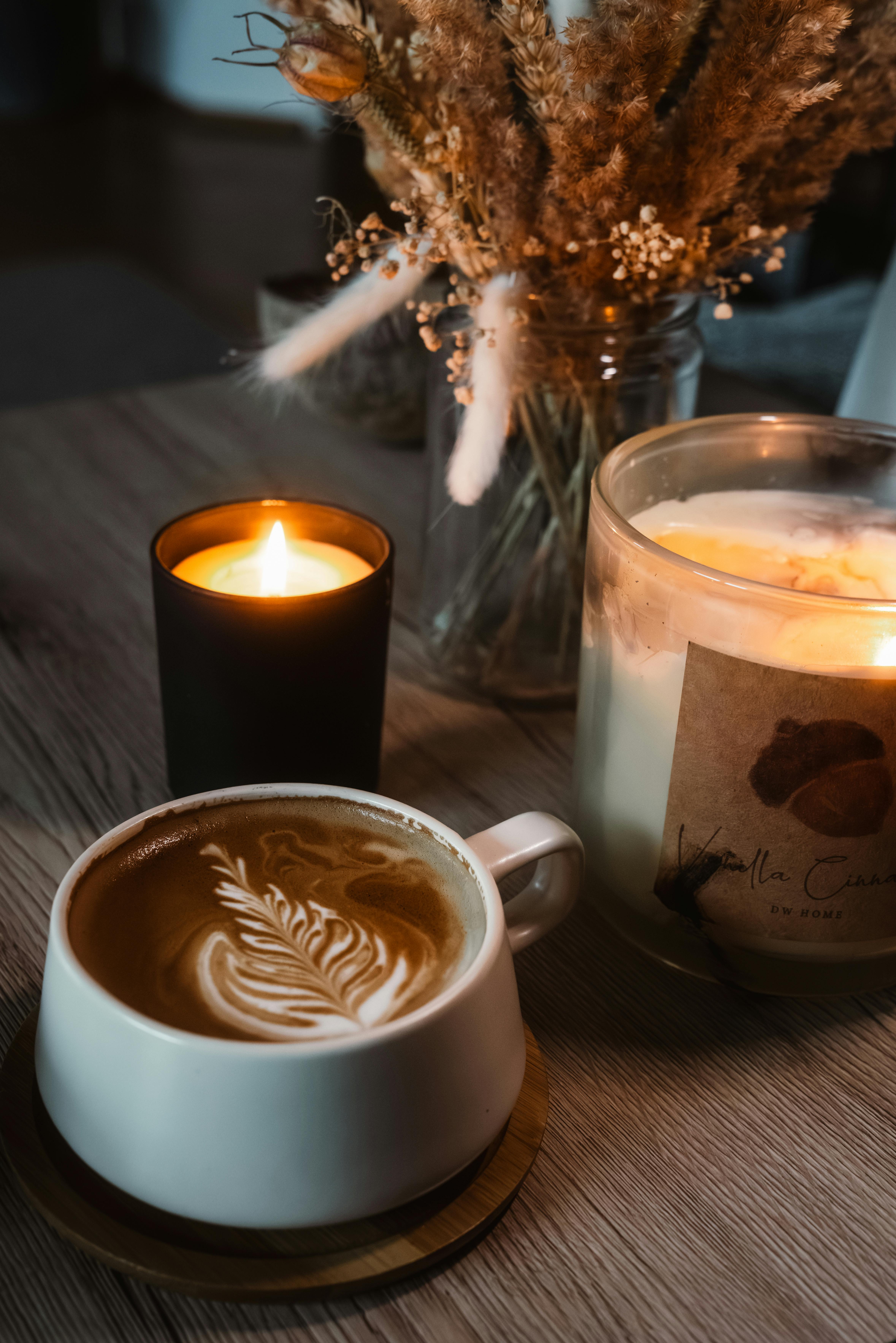 Cozy Coffee Moment with Candles and Flowers · Free Stock Photo