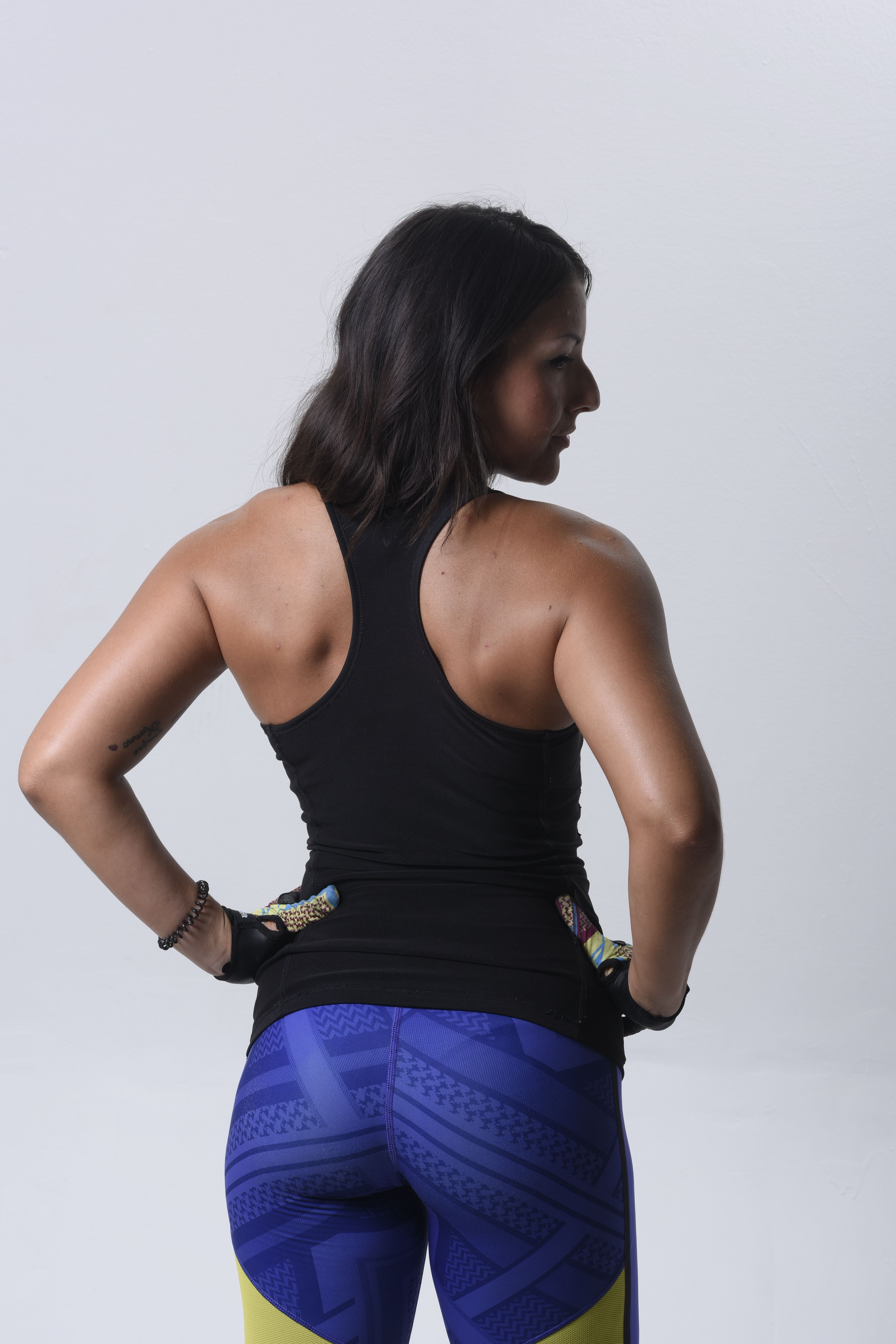 Rear View of Woman in Fitness Attire · Free Stock Photo