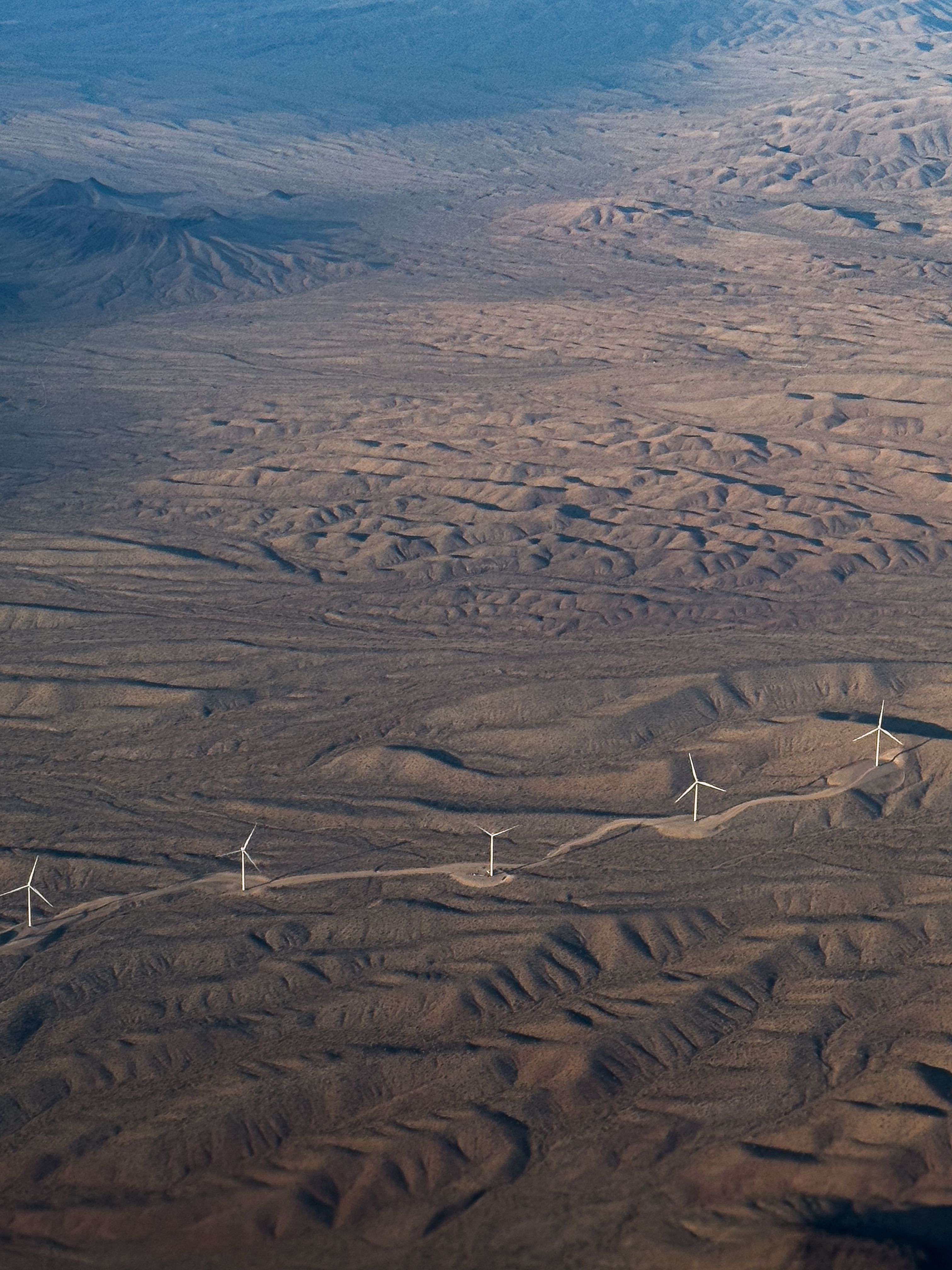 Aerial View of Wind Turbines in Desert Landscape · Free Stock Photo