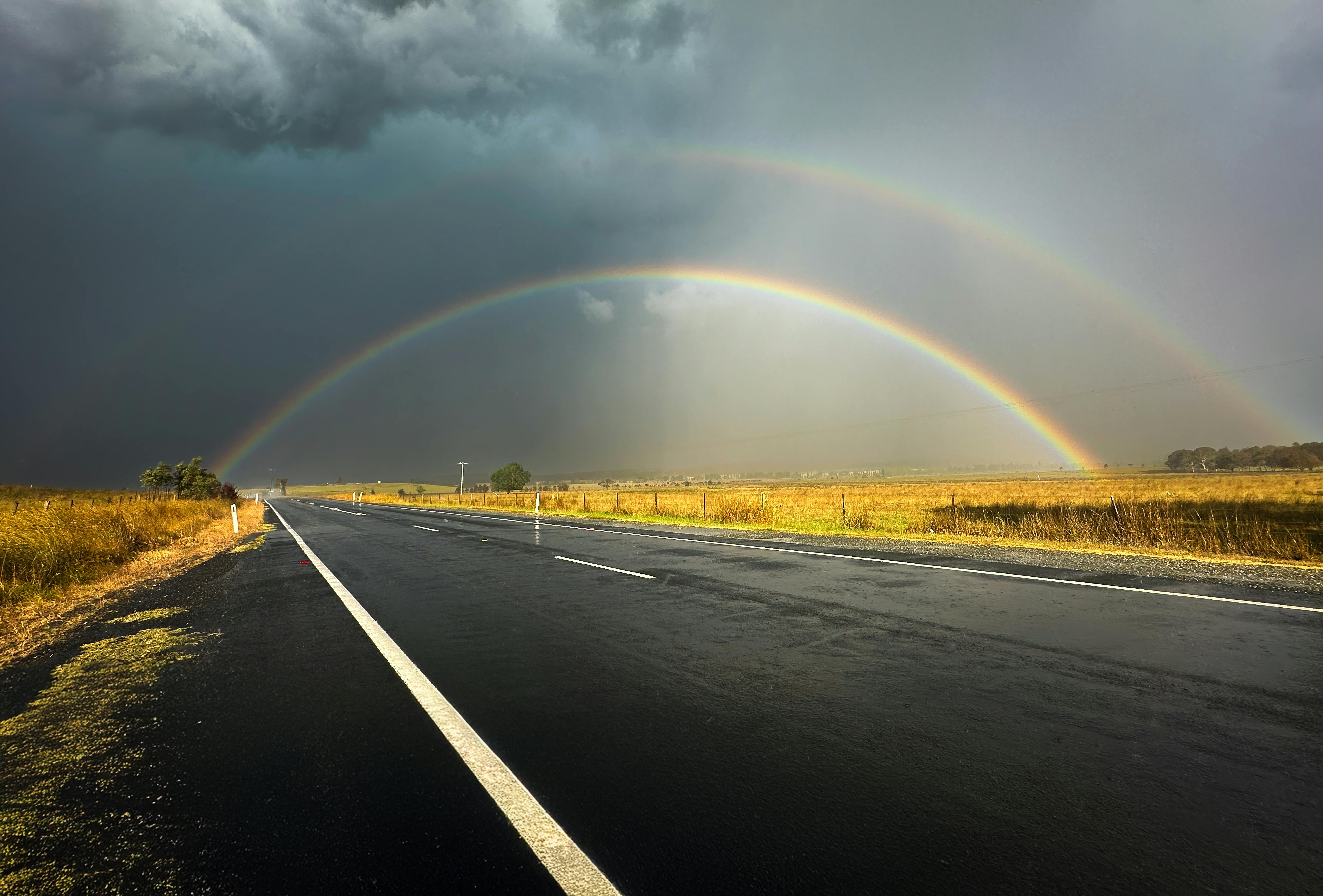 Dramatic Double Rainbow Over Country Road · Free Stock Photo