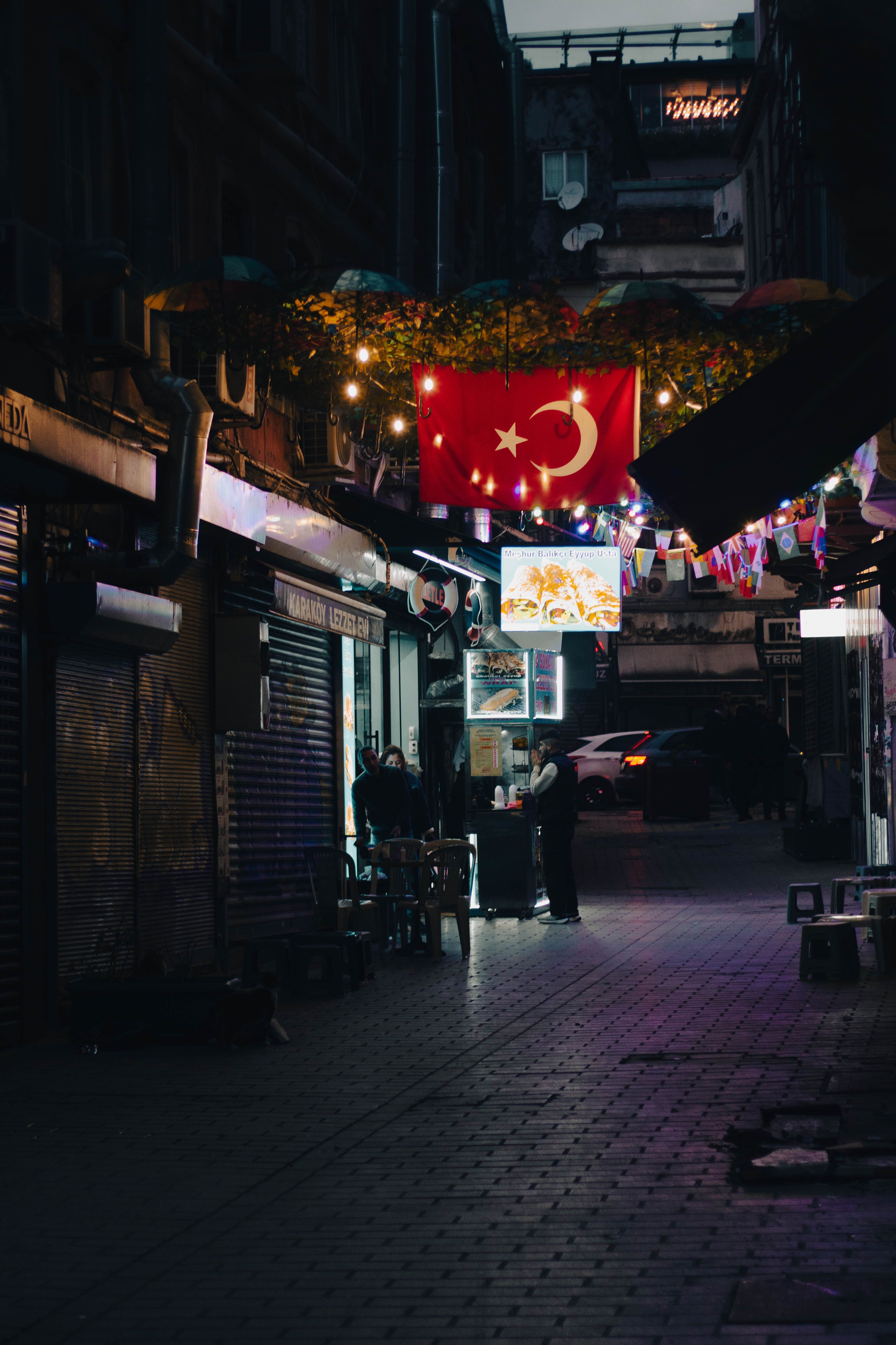Night Street Scene in Istanbul with Turkish Flag · Free Stock Photo