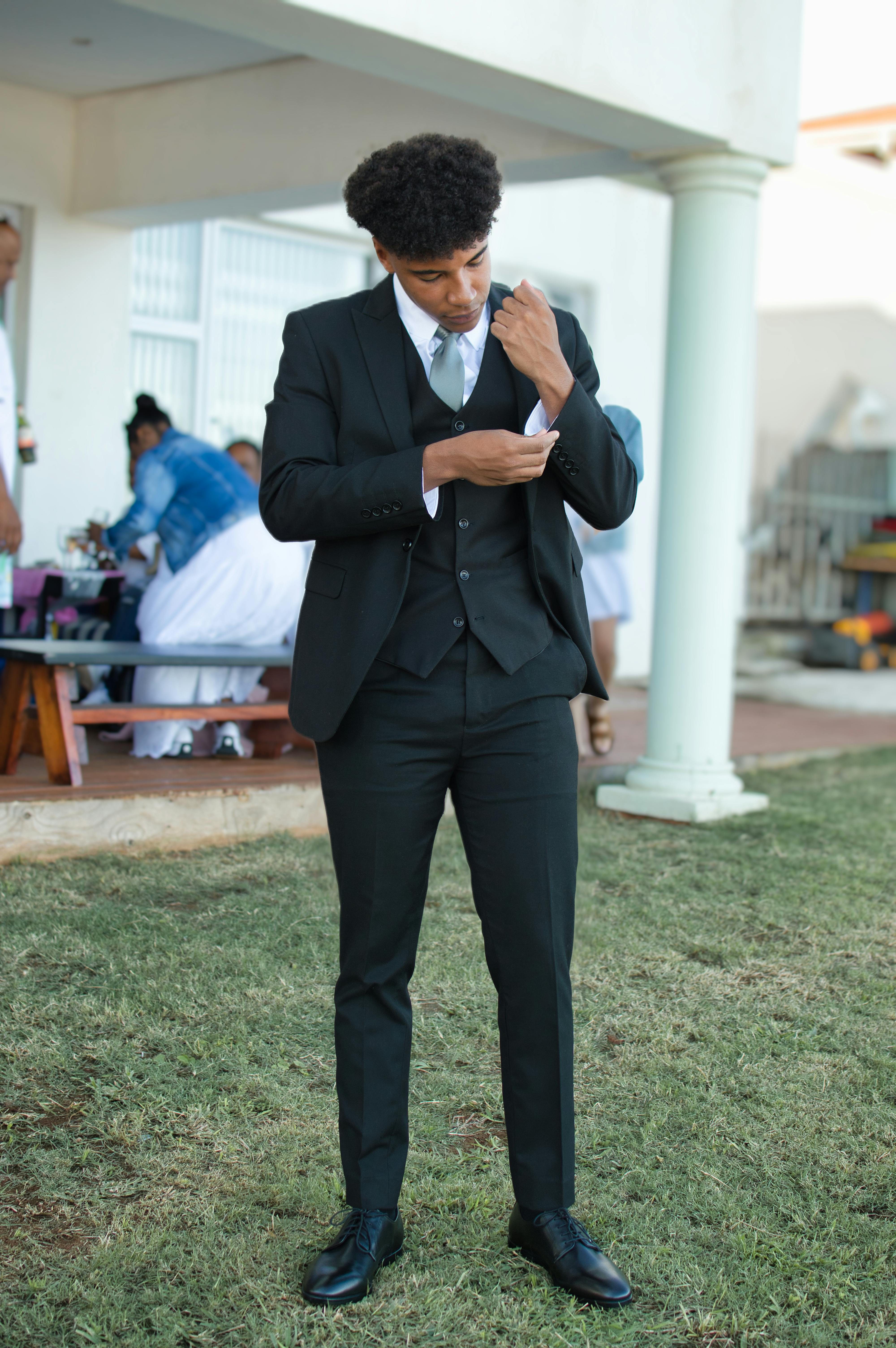 Dapper Young Man in Black Suit Outdoor Event · Free Stock Photo