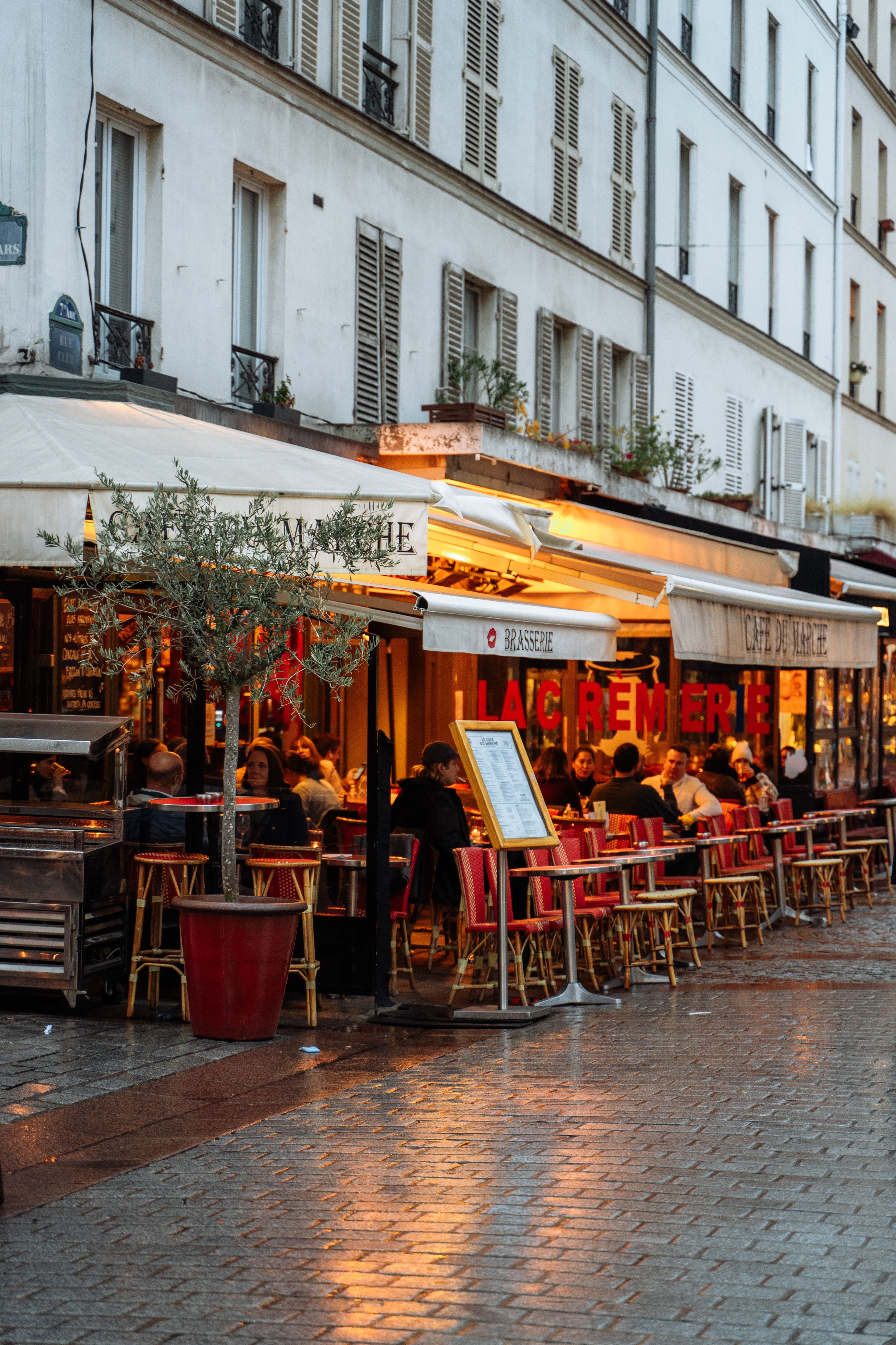 Charming Parisian Café Scene at Dusk · Free Stock Photo