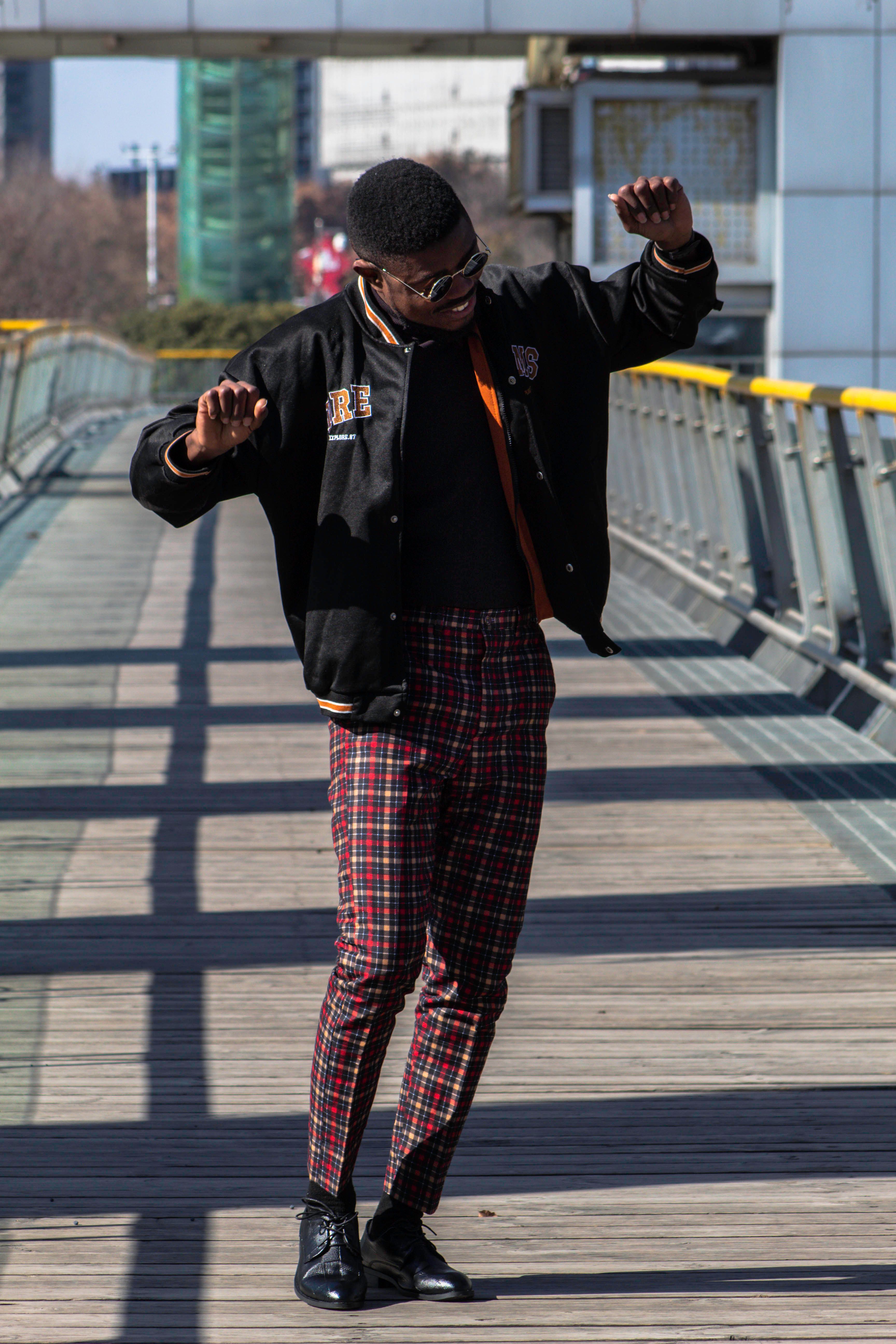 Stylish Man Dancing on Urban Bridge Outdoors · Free Stock Photo