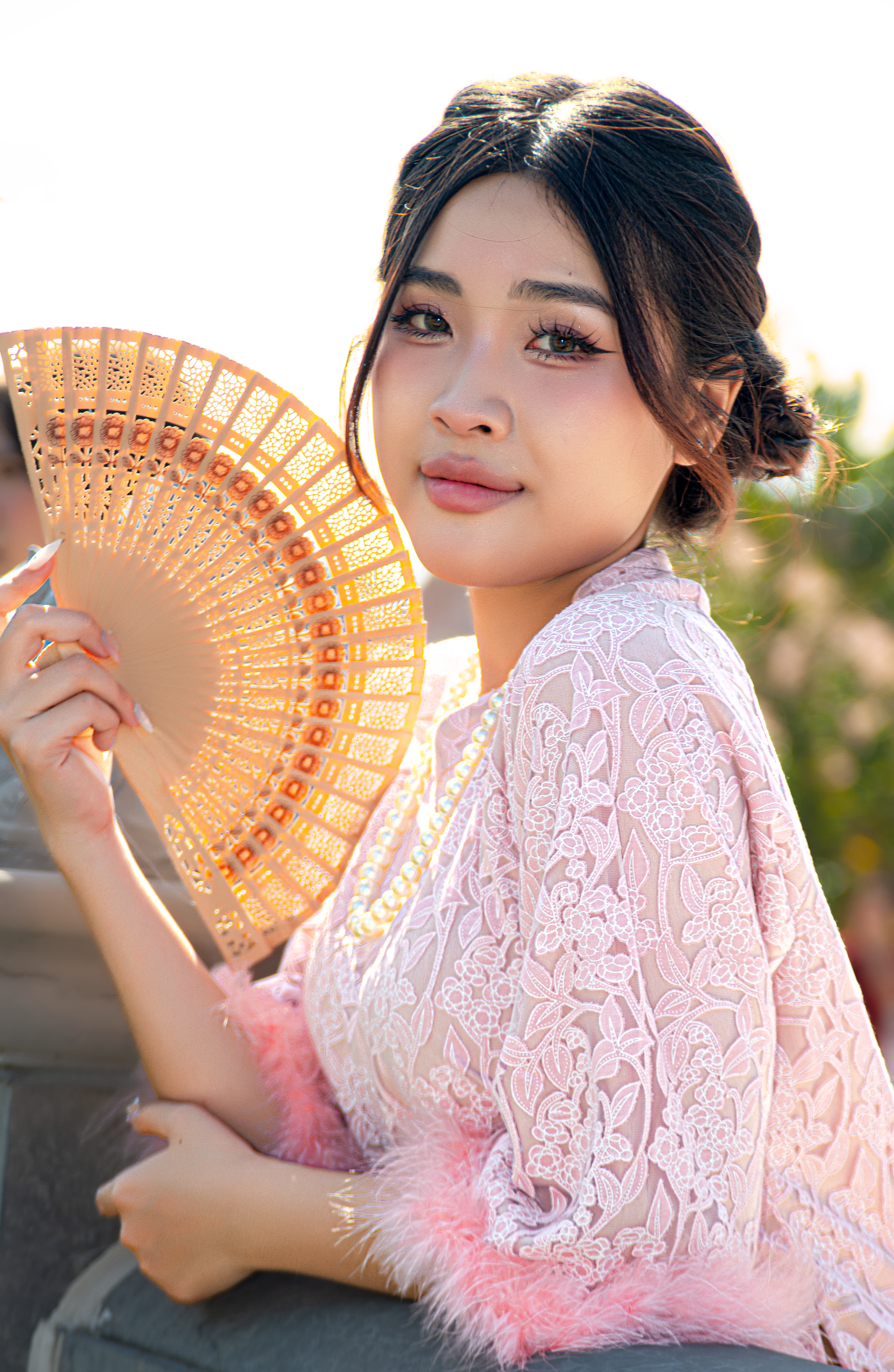 Elegant Woman in Traditional Vietnamese Dress with Fan · Free Stock Photo