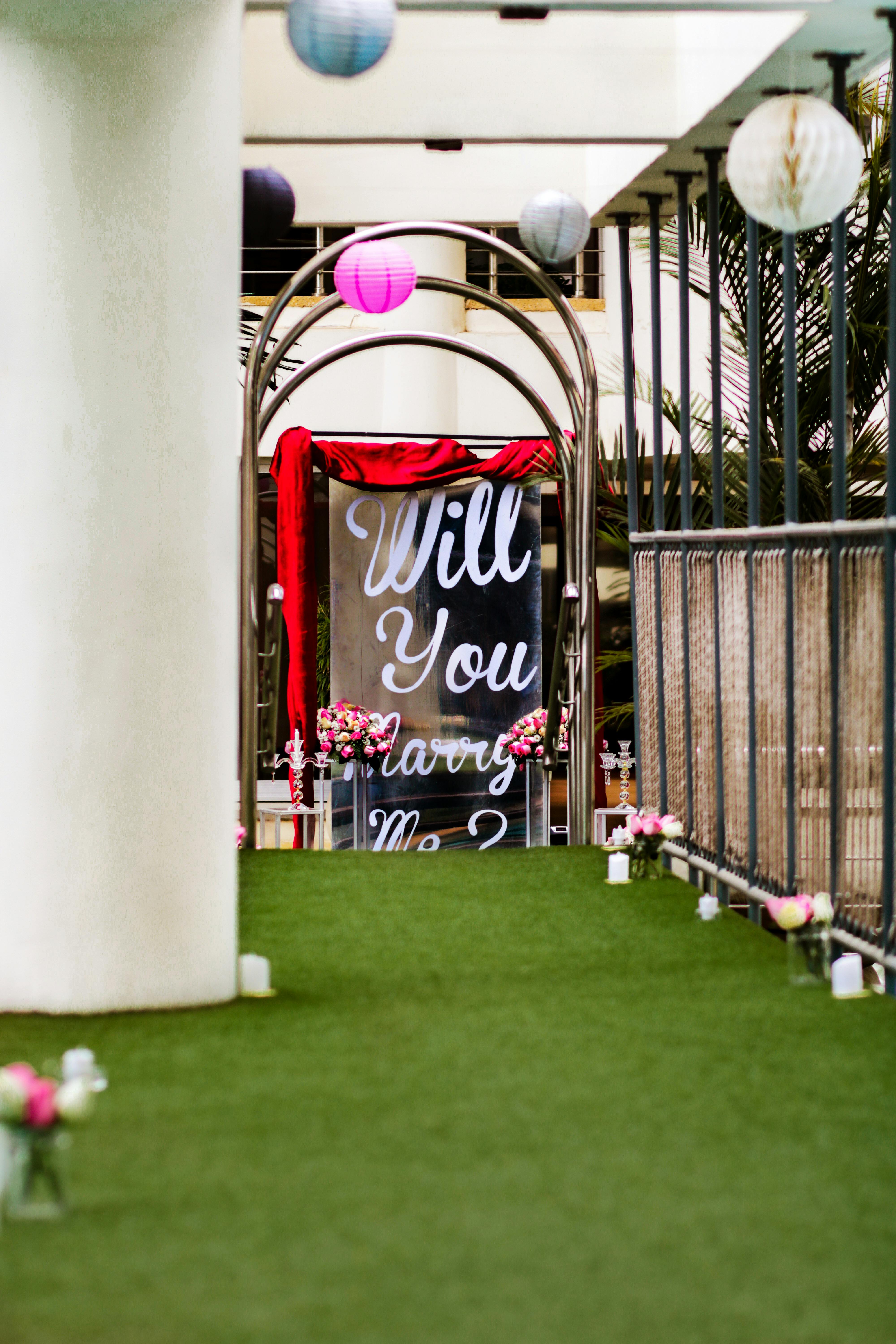 Romantic Marriage Proposal Setup with Floral Decor · Free Stock Photo