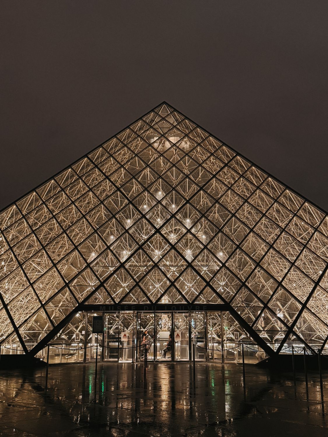 Iconic Louvre Pyramid Illuminated at Night · Free Stock Photo
