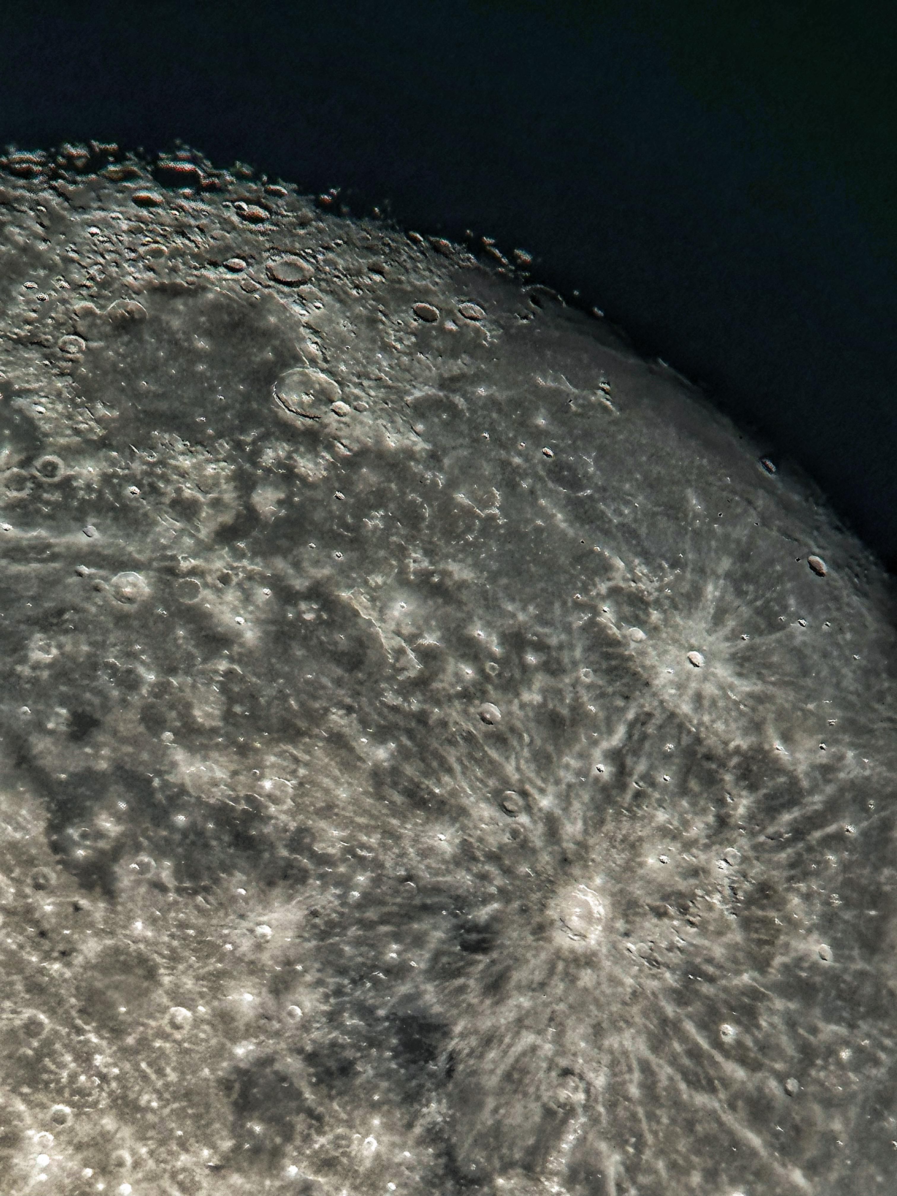 Close-up View of Moon's Surface with Craters · Free Stock Photo
