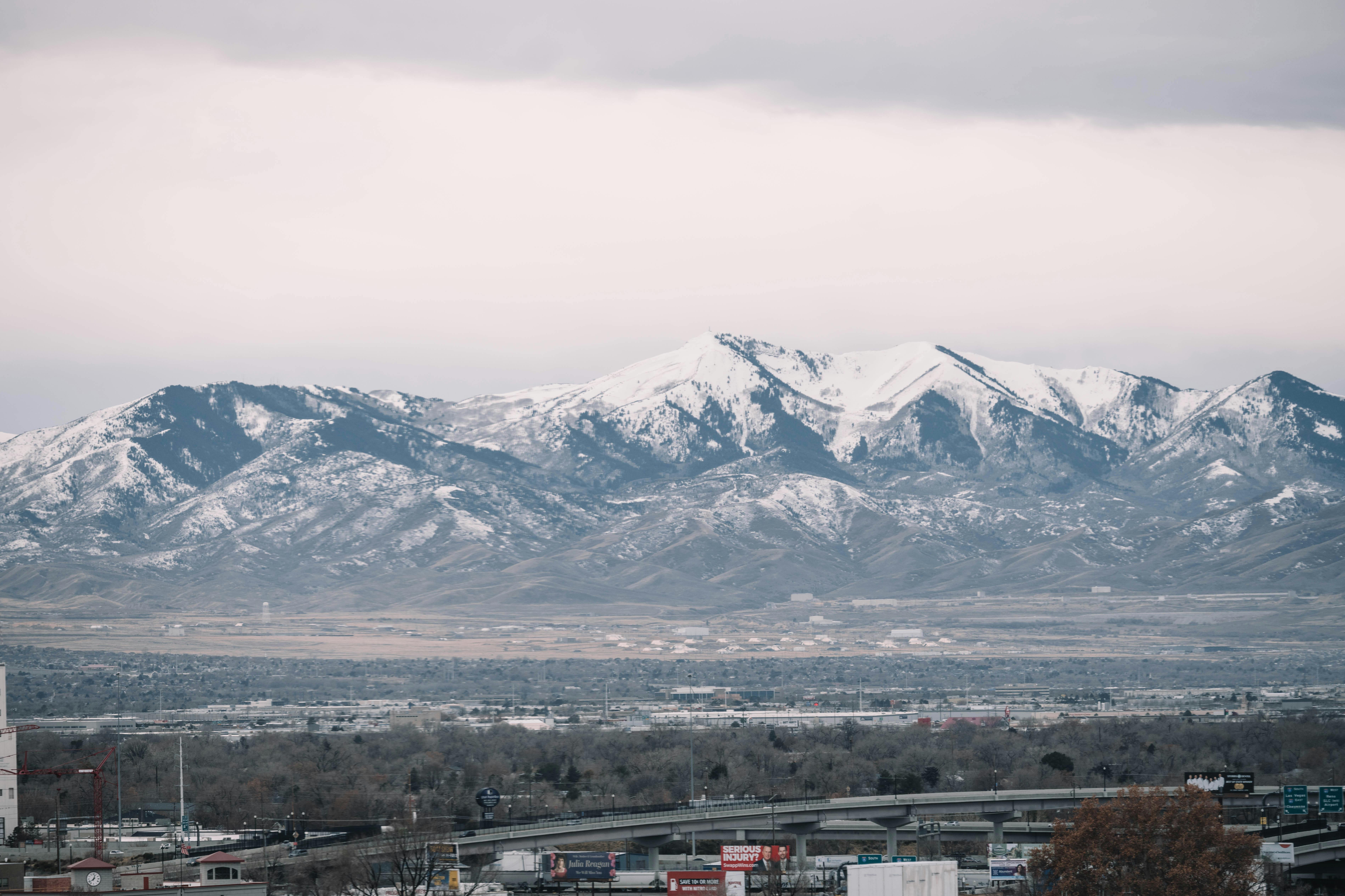 Snow-Capped Mountains Overlooking Salt Lake City Skyline · Free Stock Photo