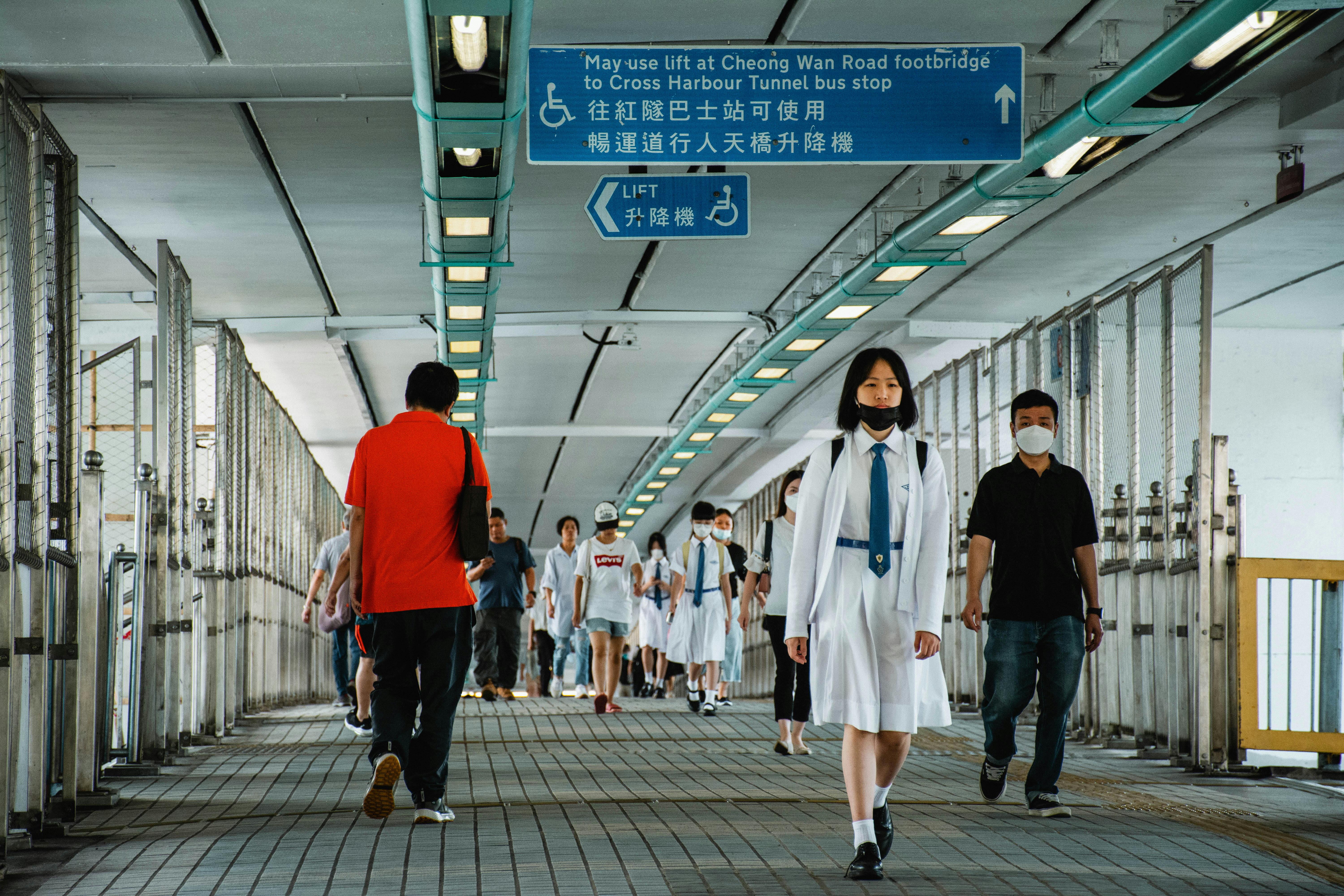 People Walking on Cheong Wan Road Footbridge · Free Stock Photo