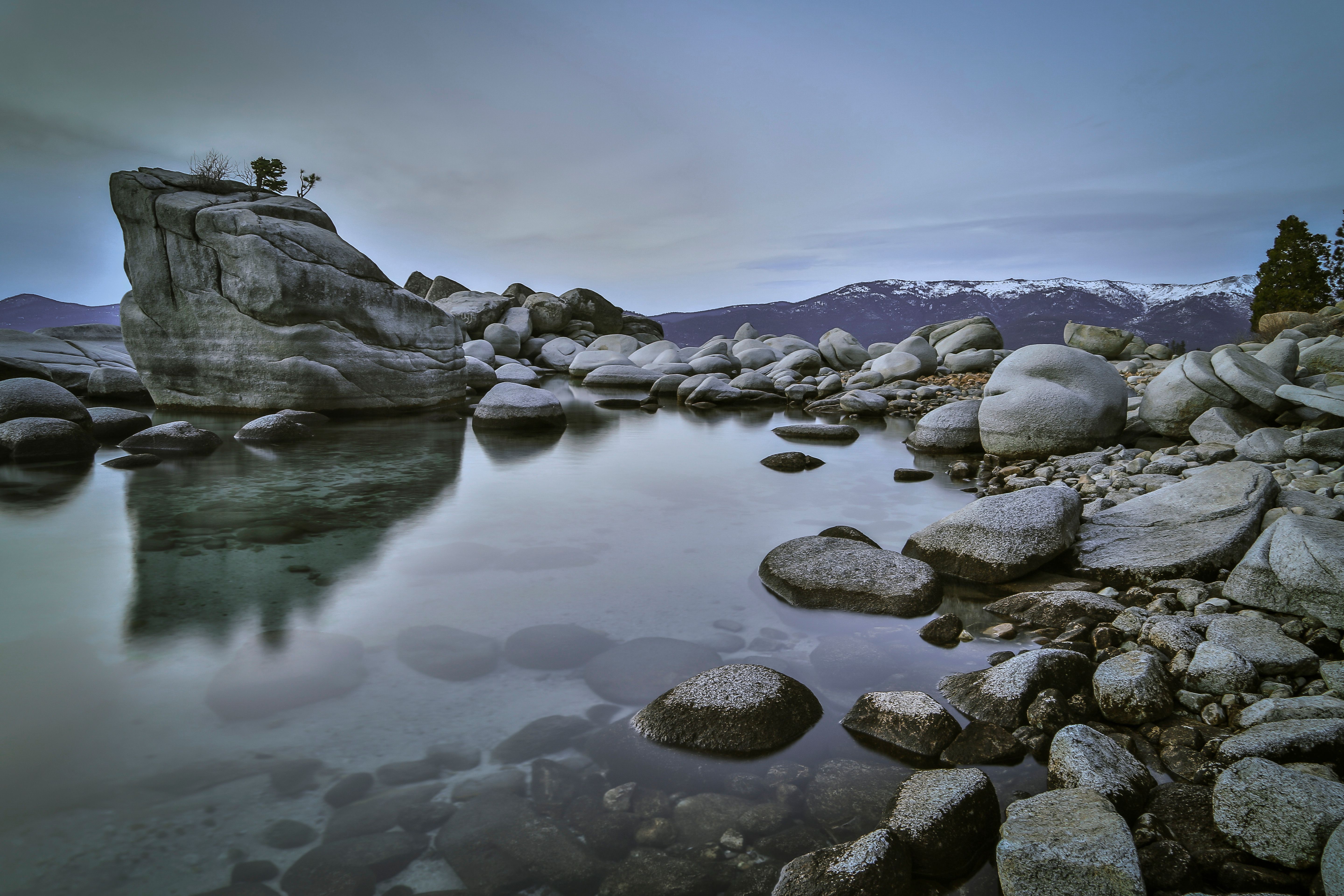 Tranquil Lake Tahoe Landscape with Rocks · Free Stock Photo