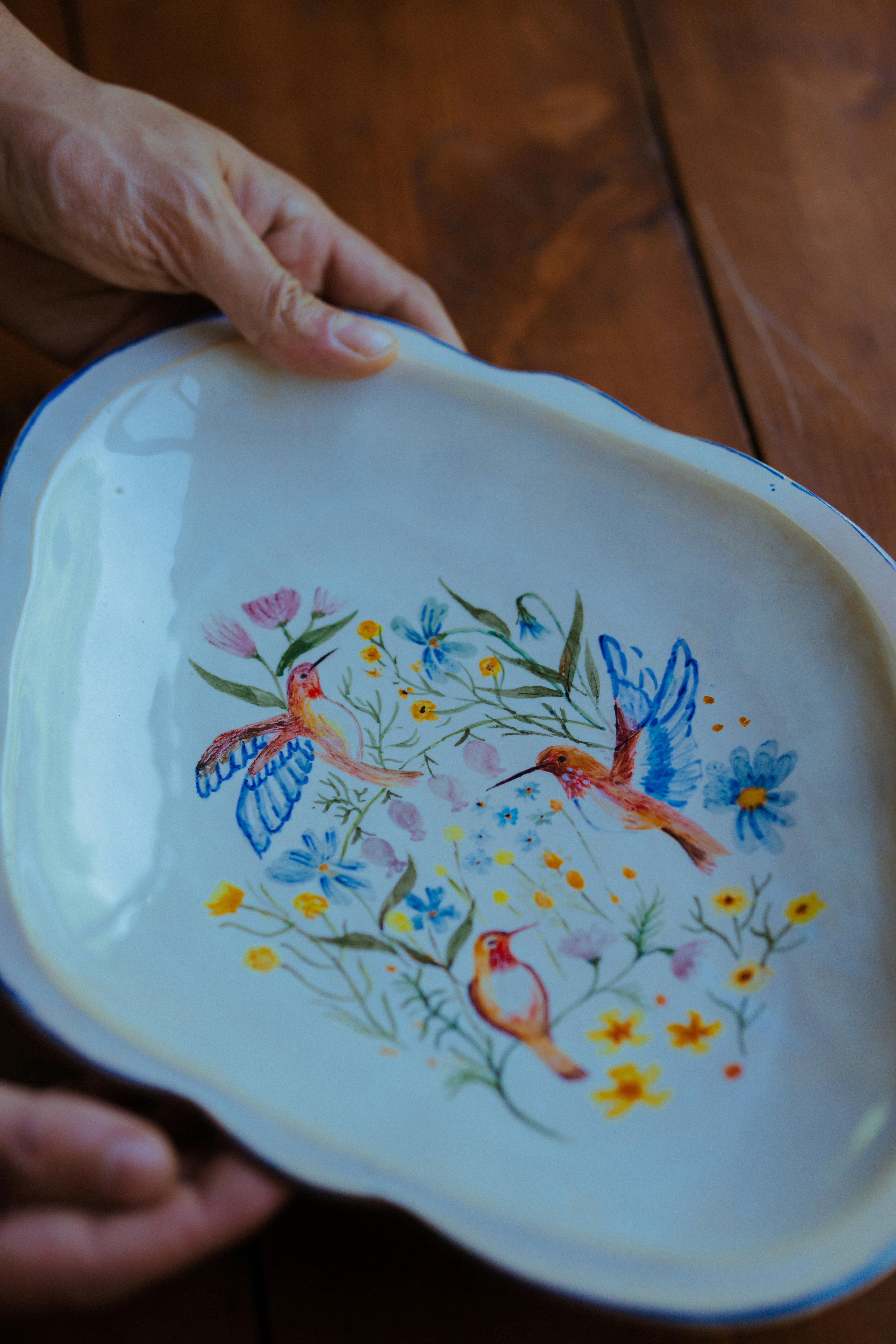 Hand-Painted Ceramic Dish with Floral Hummingbird Design · Free Stock Photo