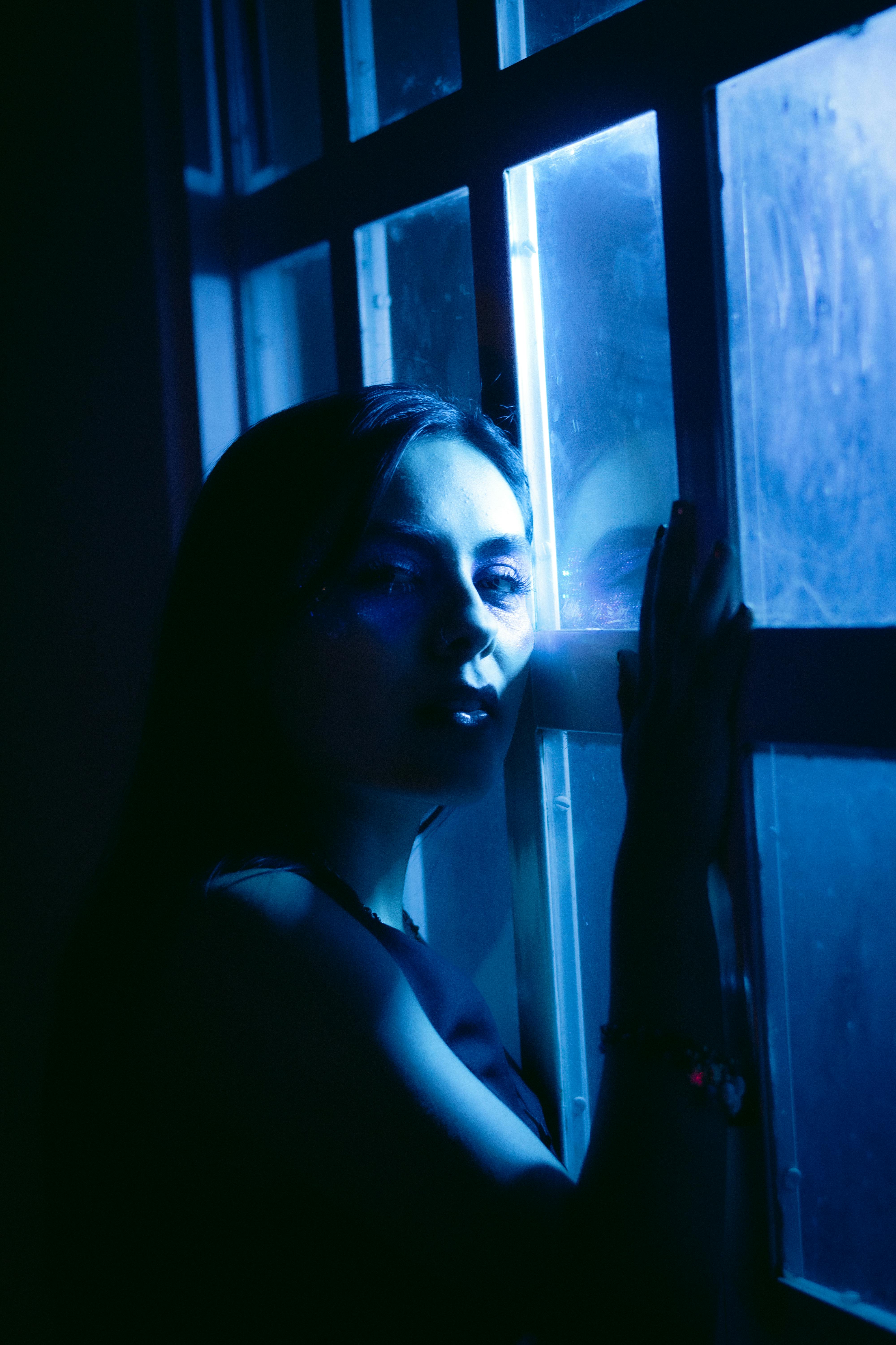 Moody Blue Light Portrait by Window · Free Stock Photo