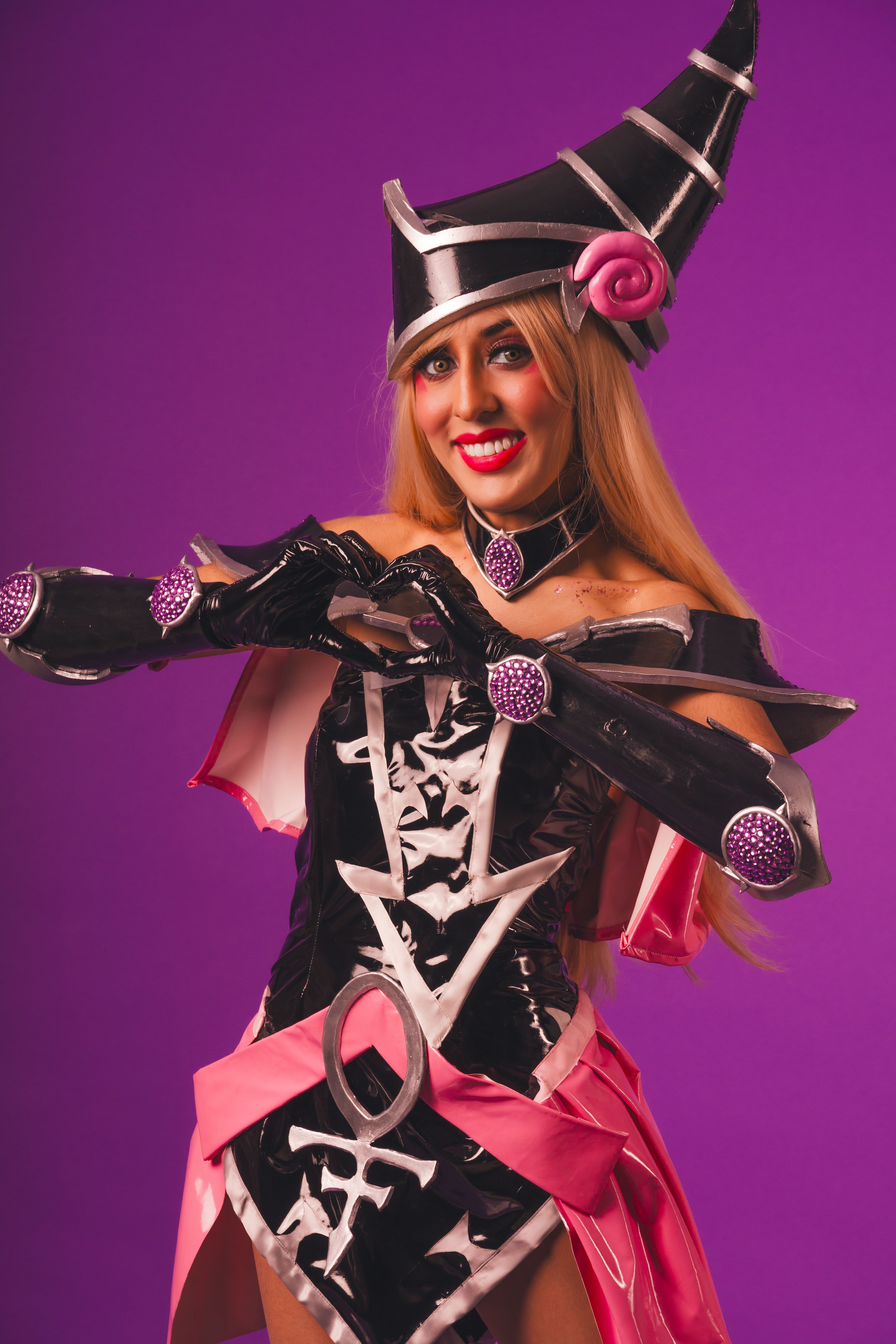 Vibrant Dark Magician Girl Cosplay with Pink Accents · Free Stock Photo