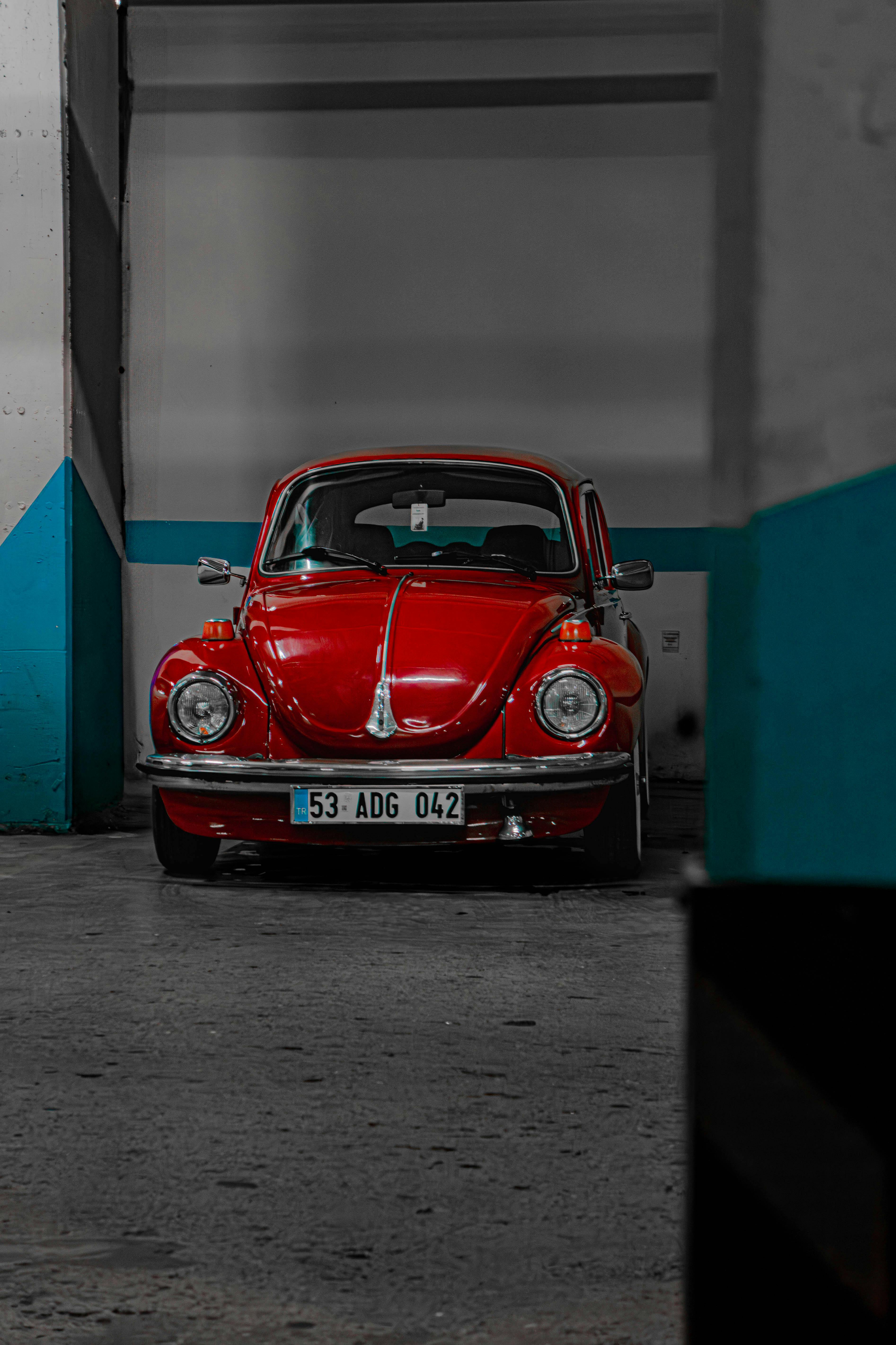Classic Red Beetle Car in Dimly Lit Garage · Free Stock Photo
