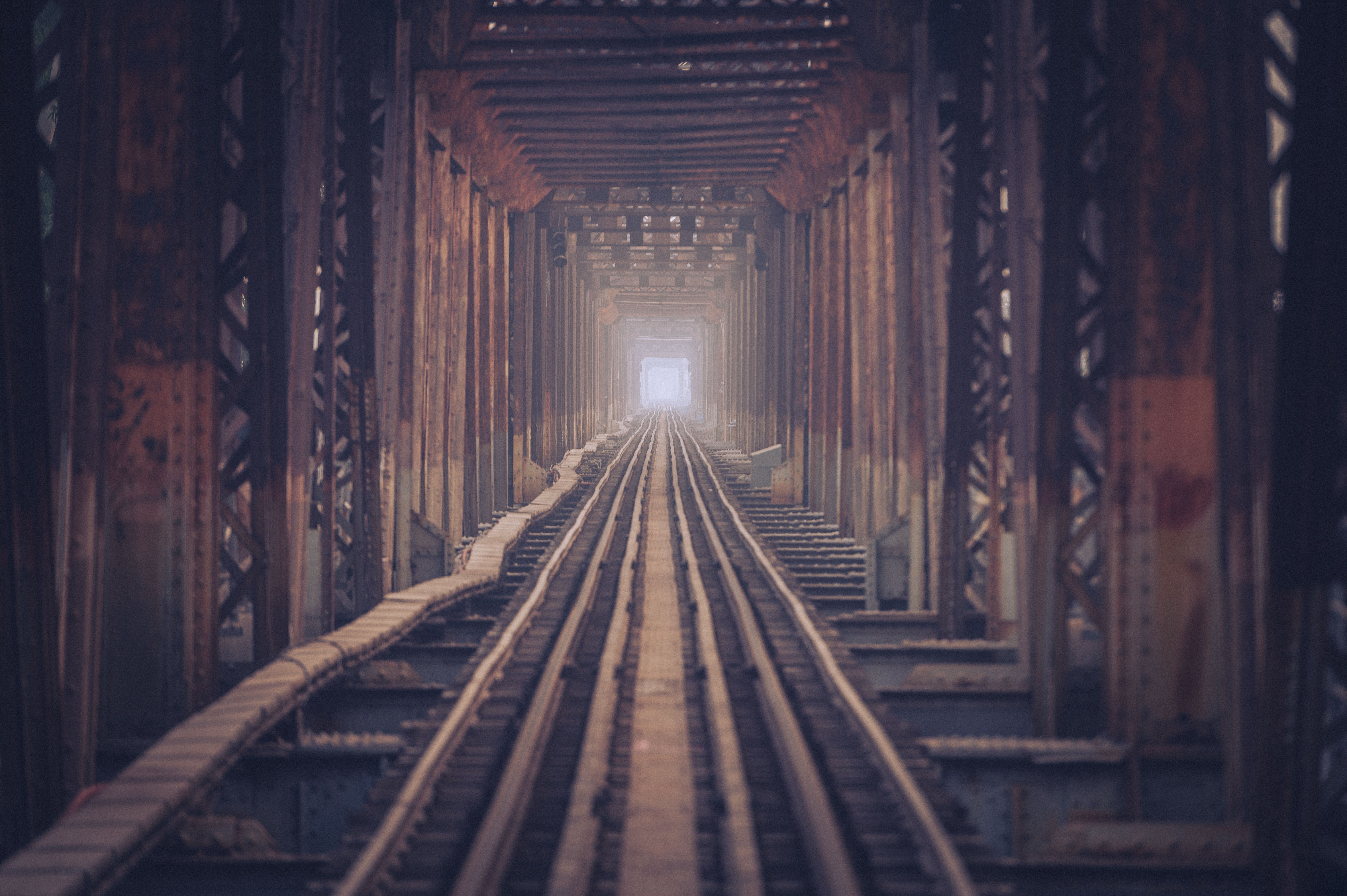 Rustic Iron Bridge with Rail Tracks at Dusk · Free Stock Photo