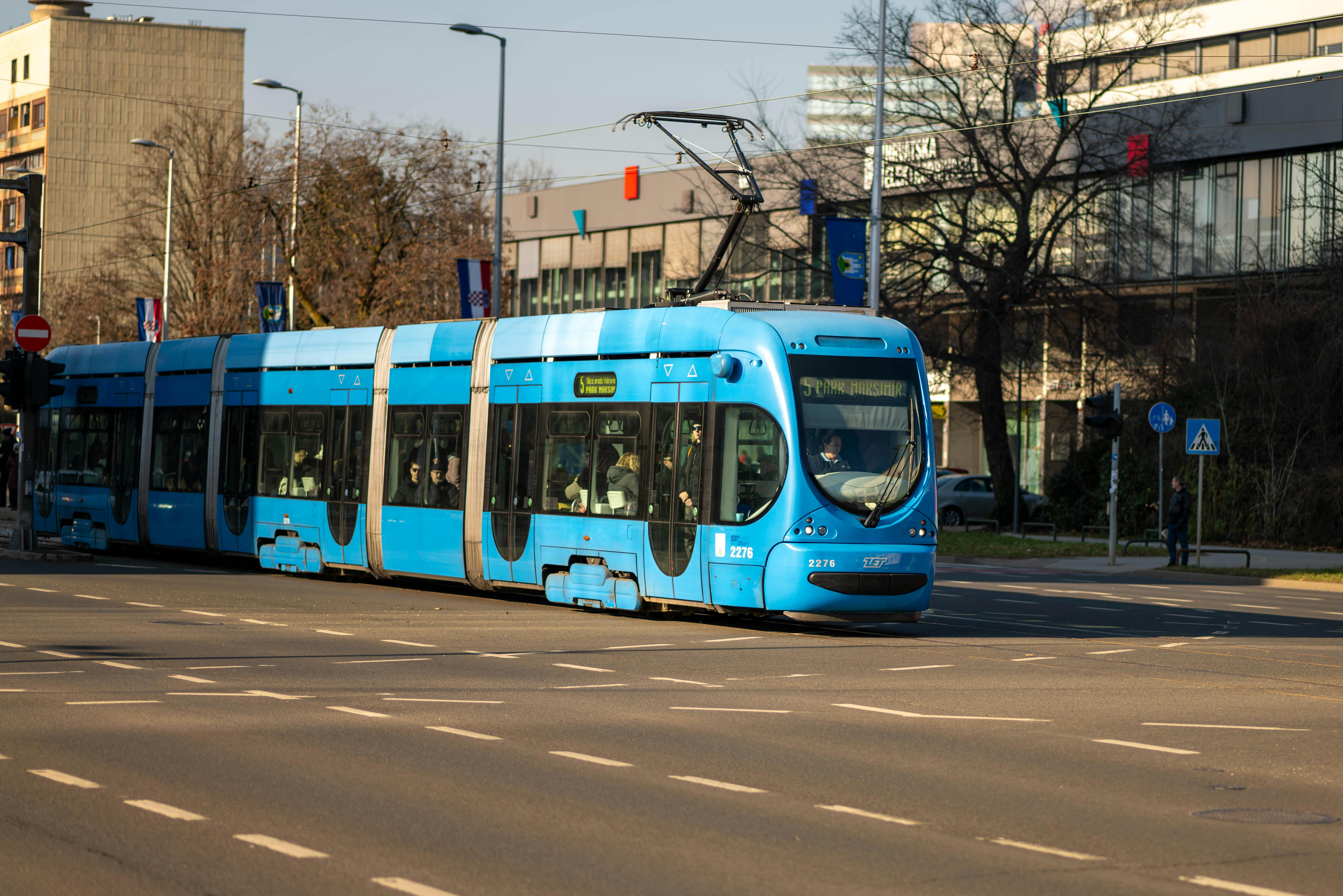 Blue Tram in Zagreb City Street on Sunny Day · Free Stock Photo
