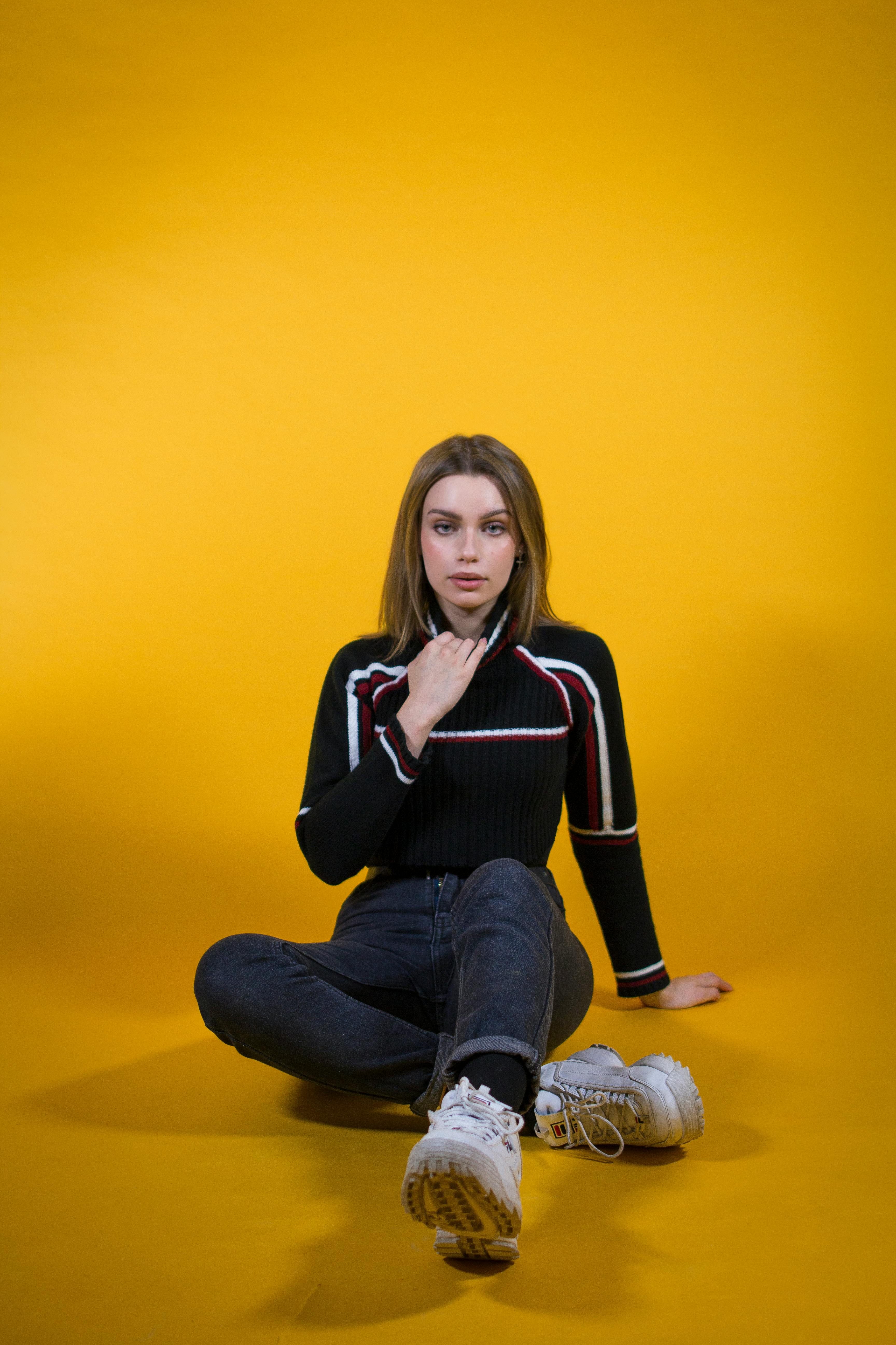 Photo Of Woman Sitting On Ground · Free Stock Photo