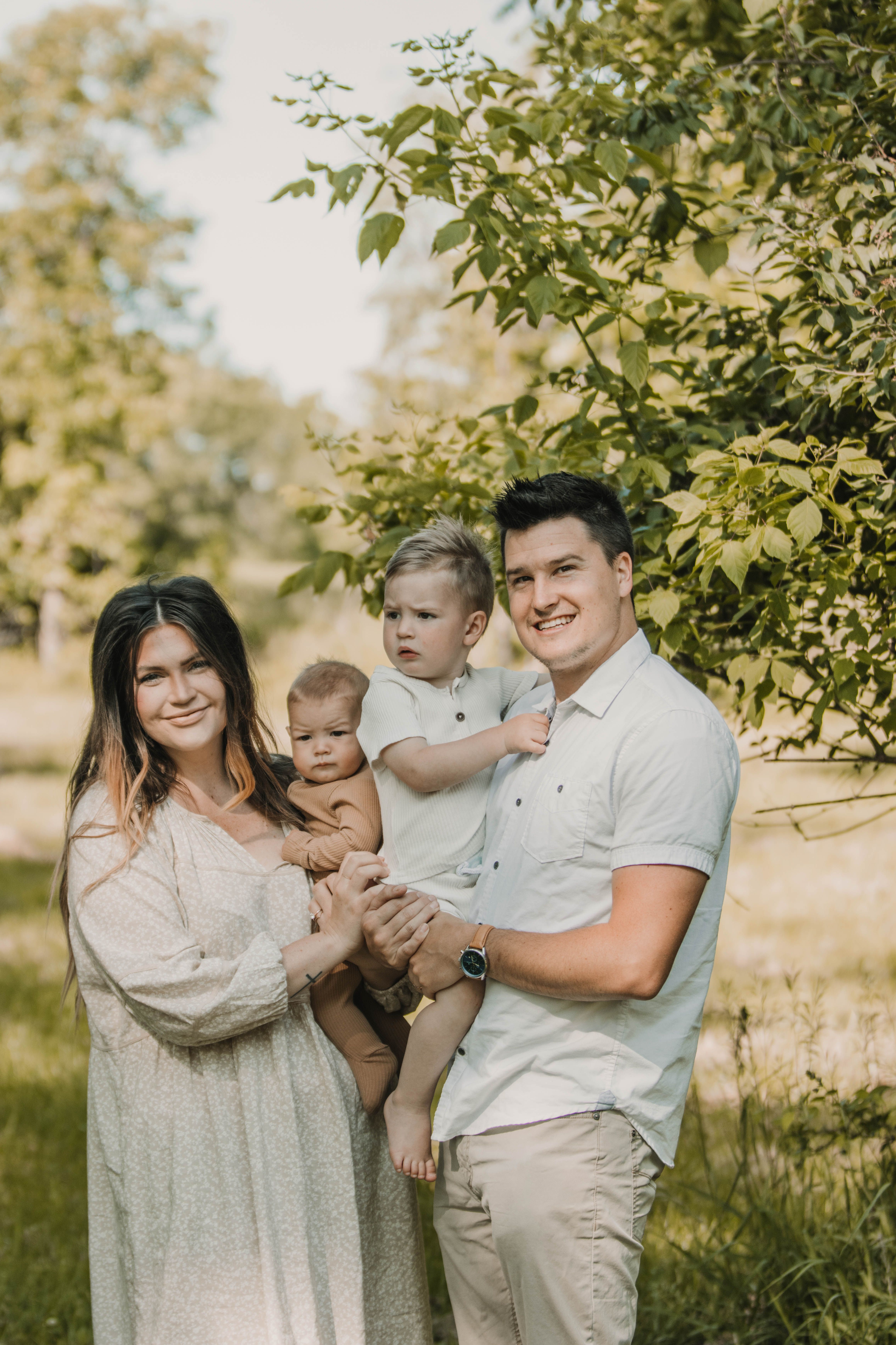 Charming Family Portrait in Outdoor Setting · Free Stock Photo