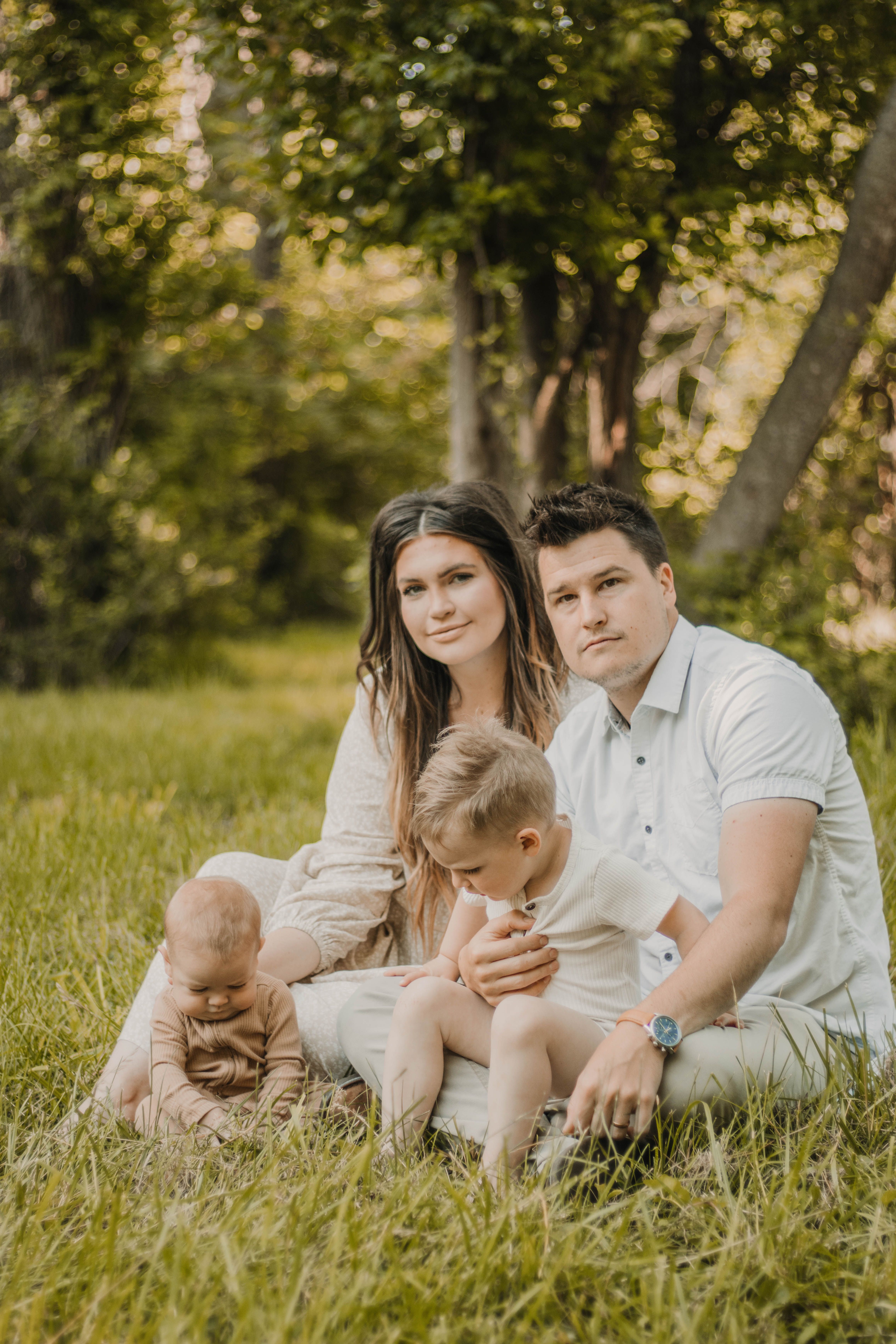 Happy Family Portrait in Natural Setting · Free Stock Photo