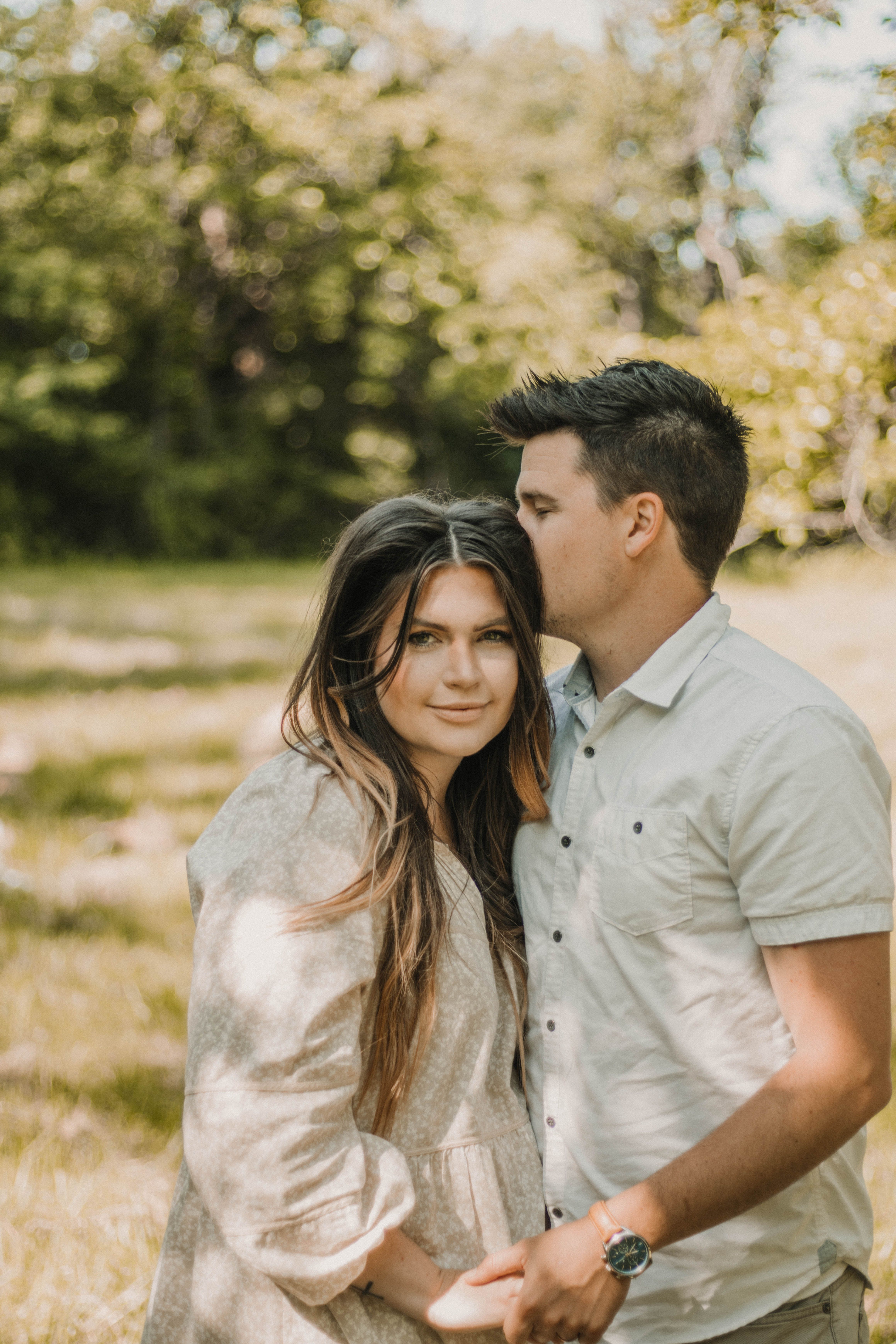 Heartfelt Outdoor Couple Portrait in Sunny Park · Free Stock Photo