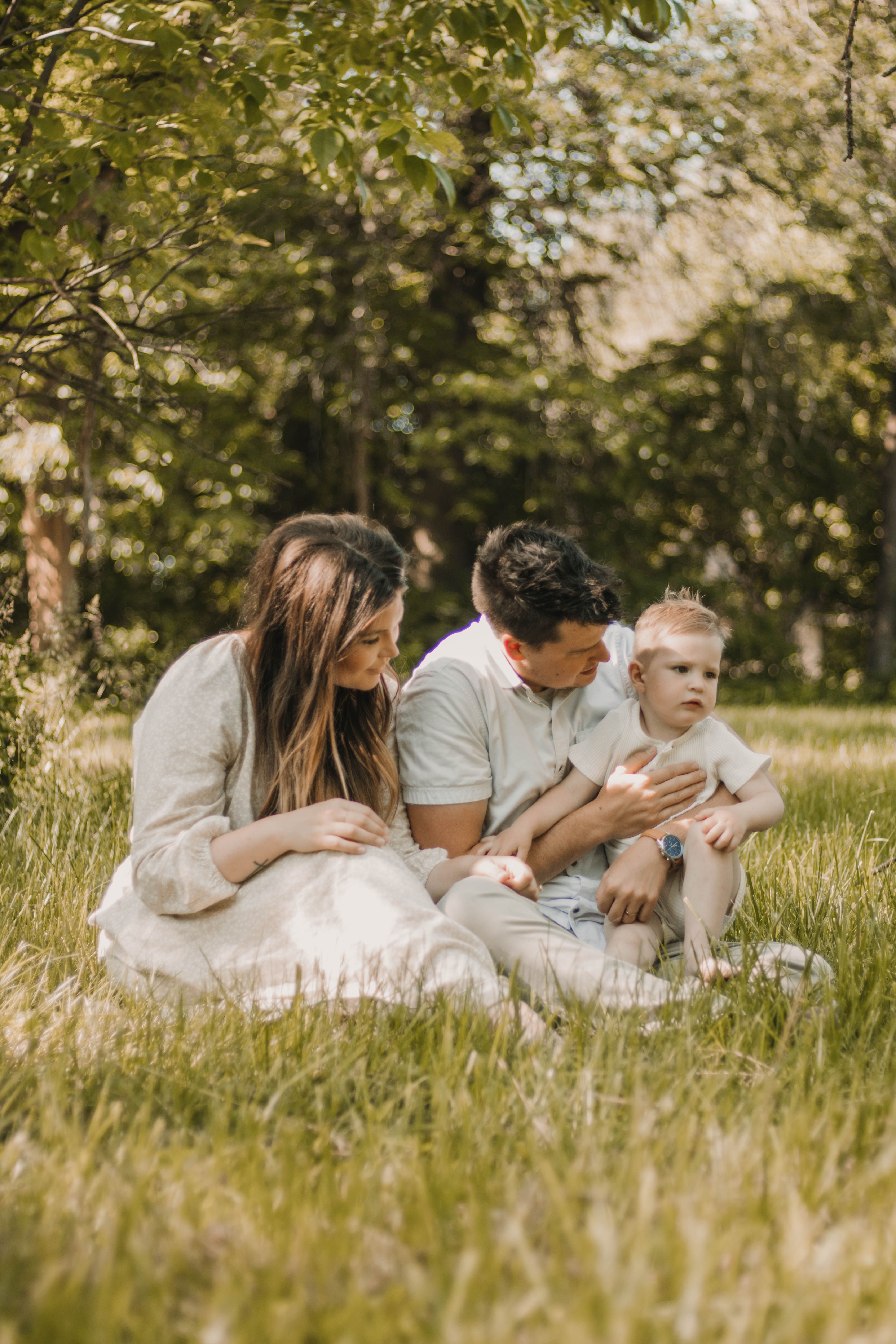 Family Enjoying Peaceful Moment in Nature · Free Stock Photo