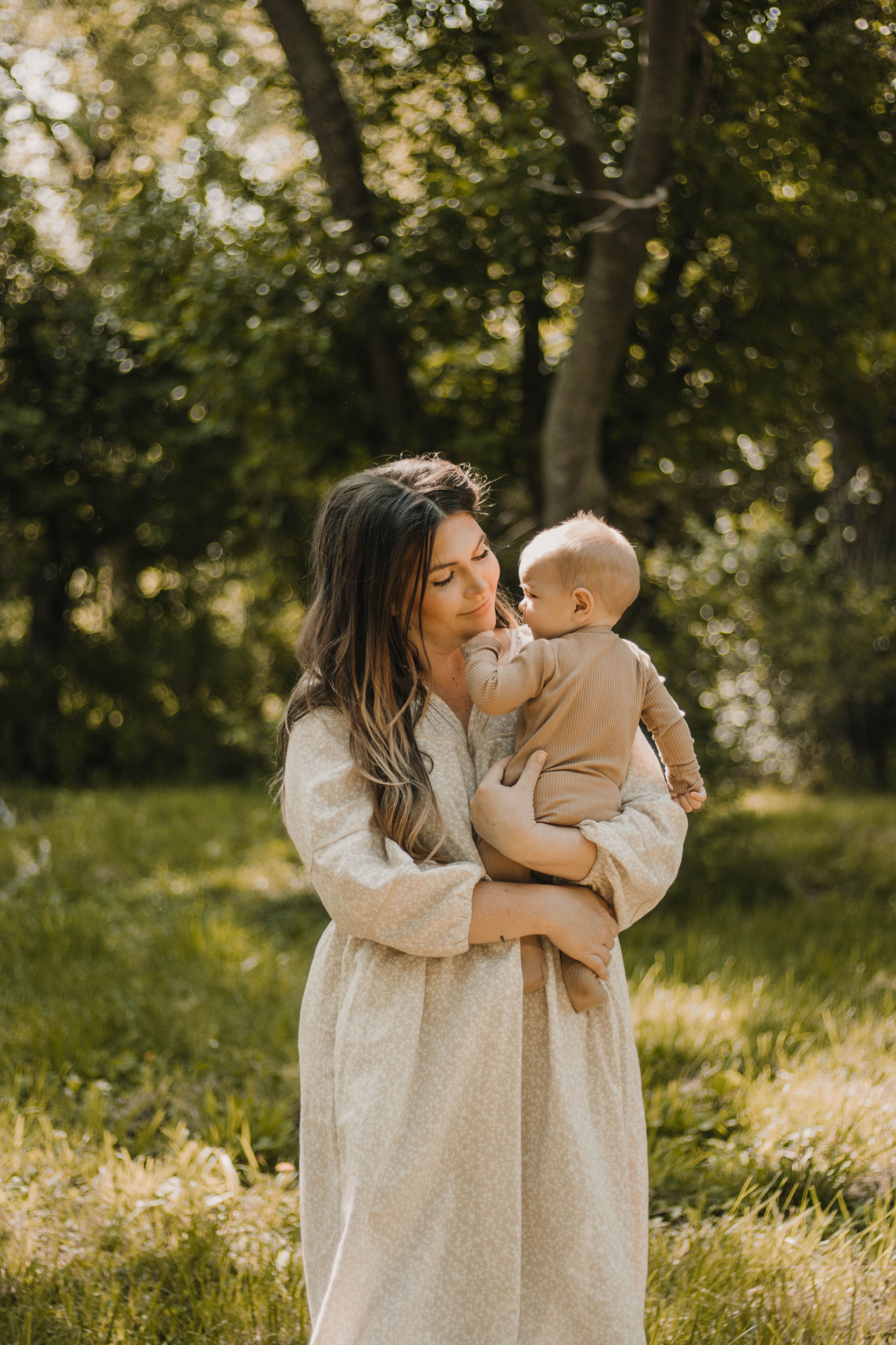 Mother and Baby Bonding in Sunny Woodland · Free Stock Photo