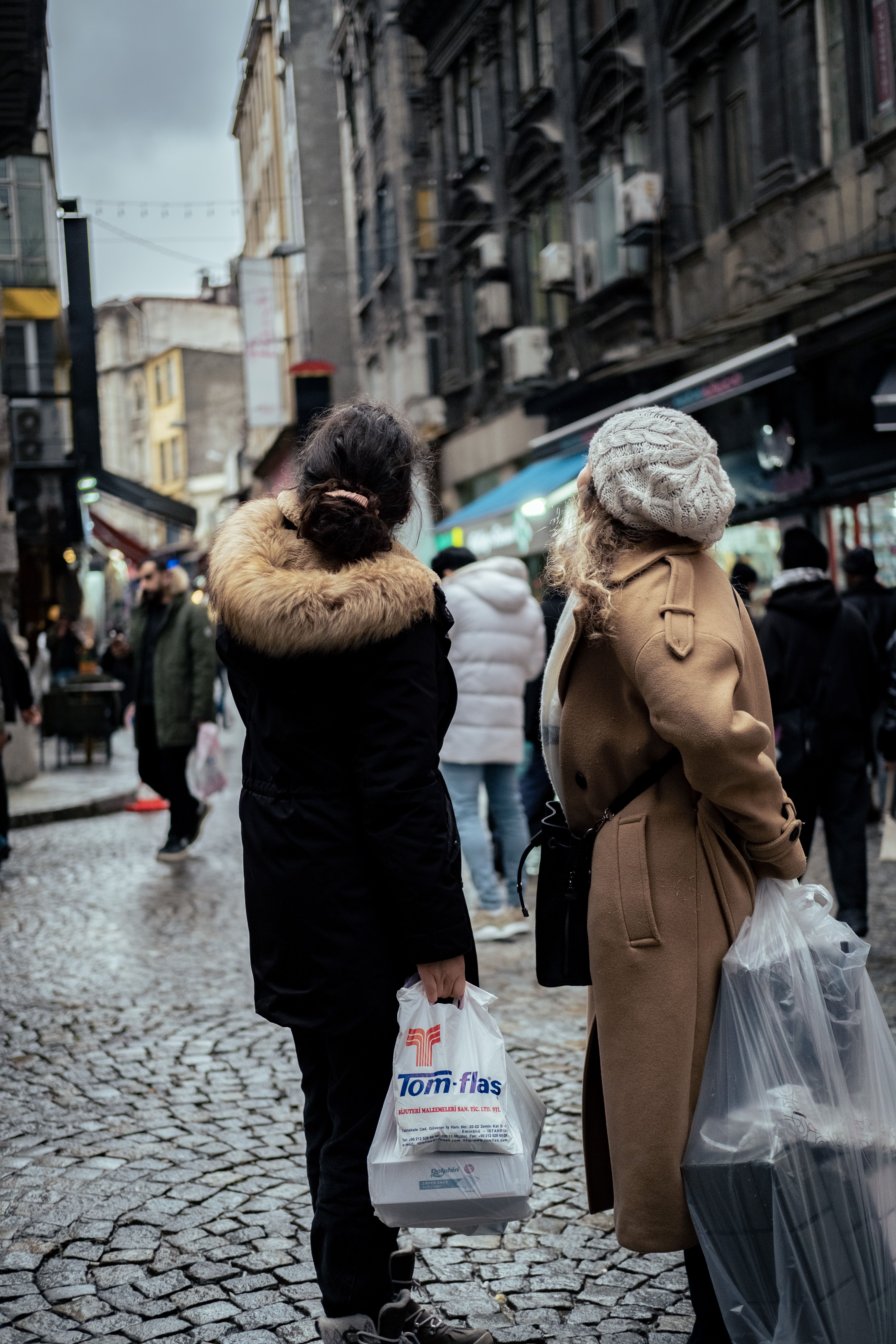 Urban Shopping Scene in Cobblestone Street · Free Stock Photo