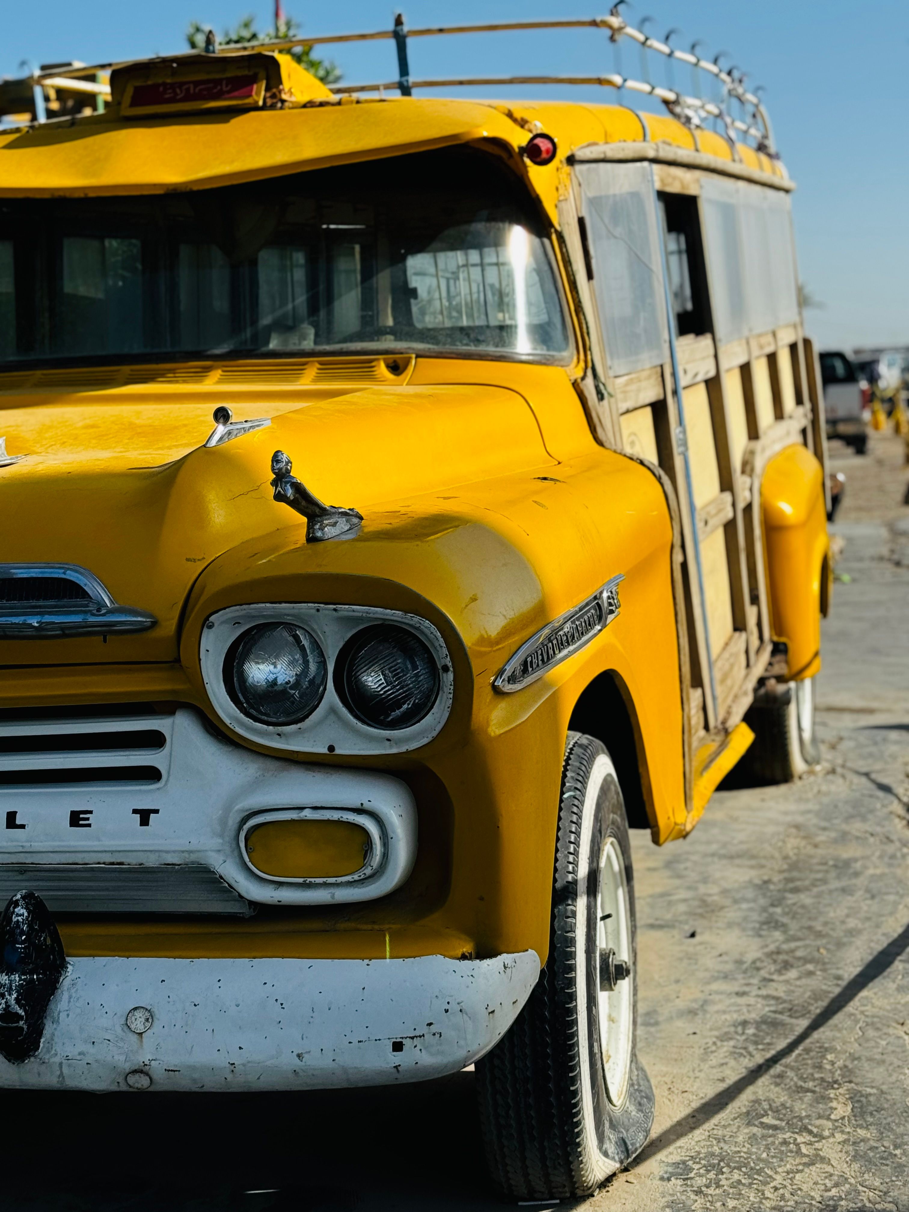 Vintage Yellow Bus on a Sunlit Street · Free Stock Photo