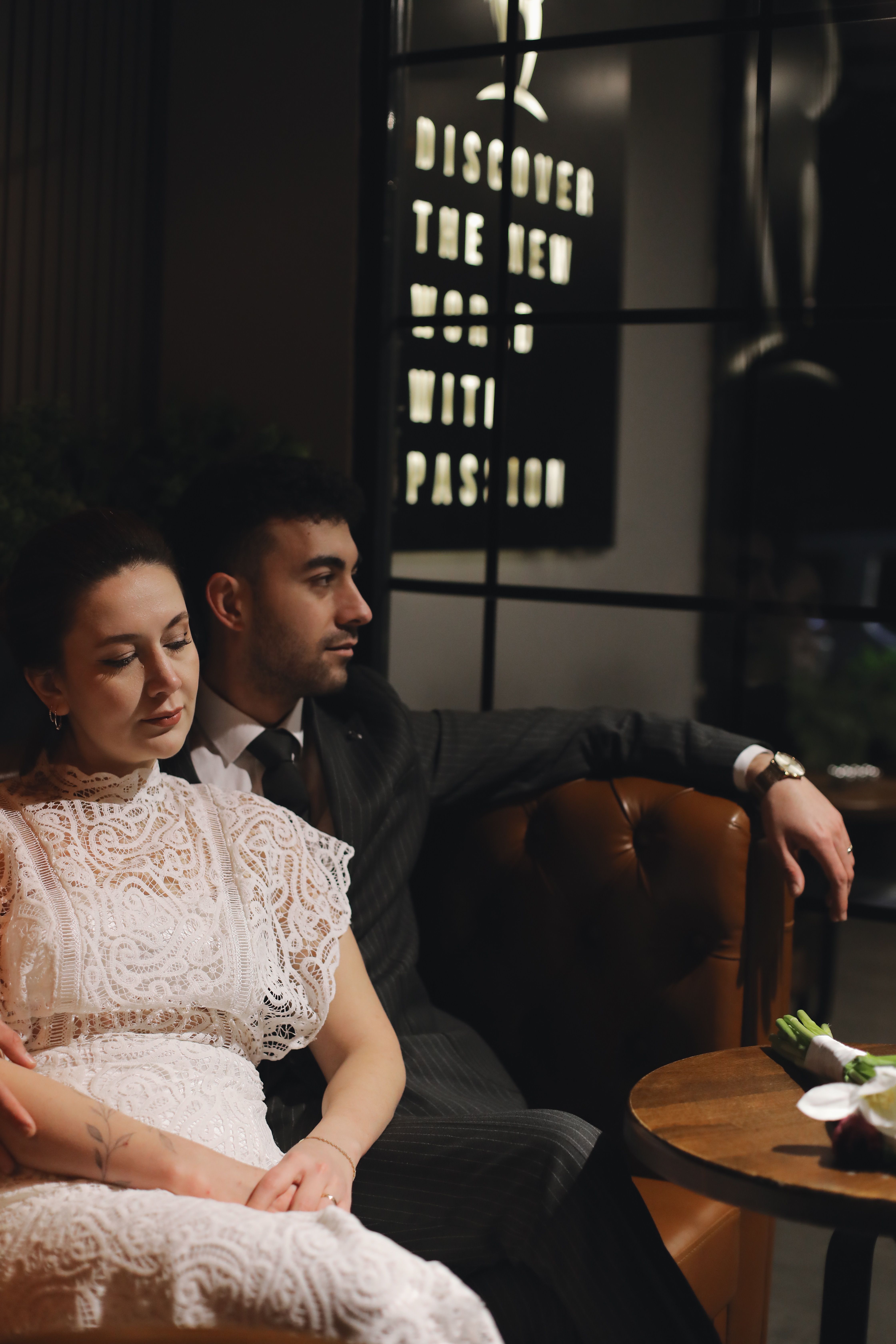 Elegant Couple Relaxed in Cozy Lounge Setting · Free Stock Photo