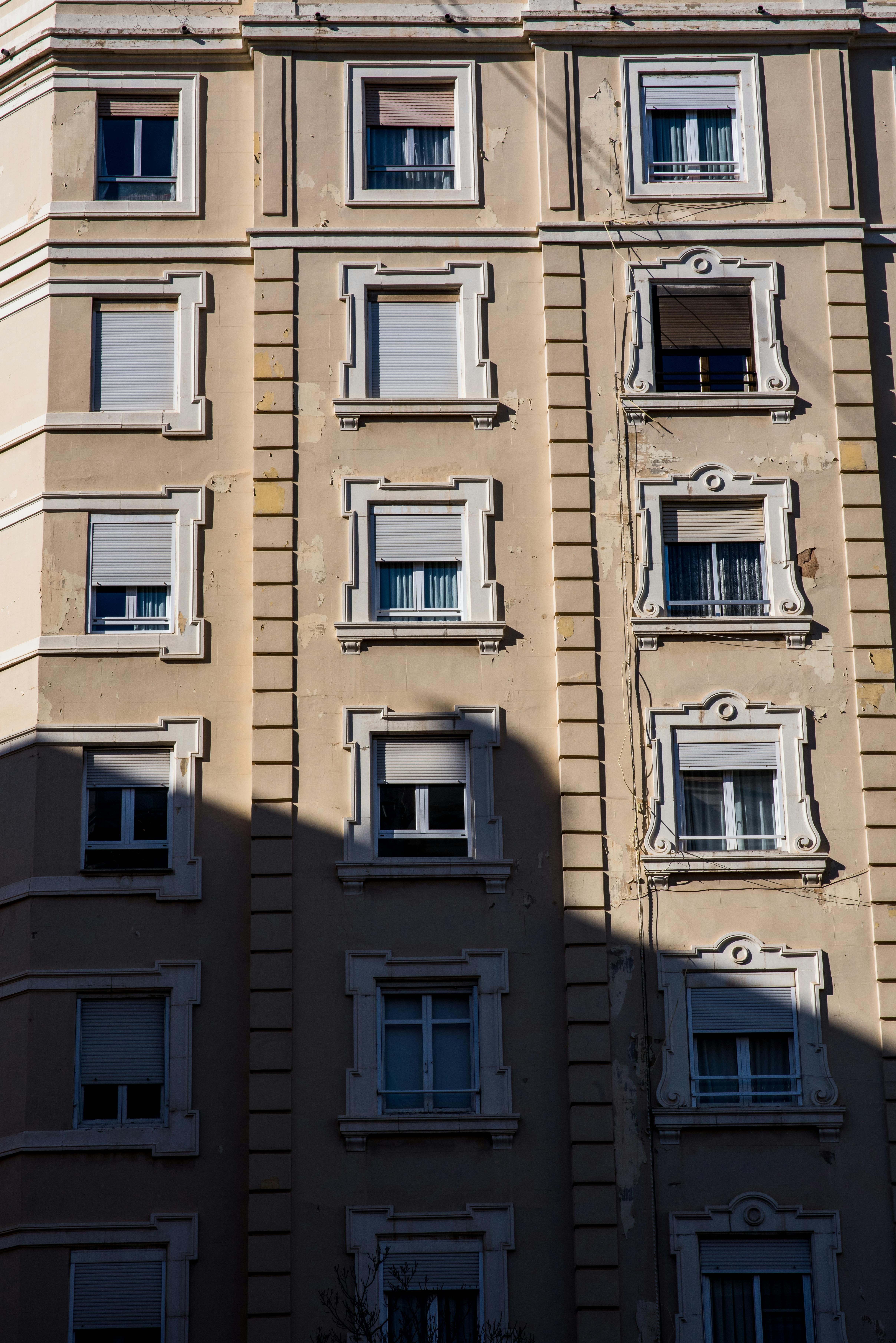 Shadowed Urban Apartment Building Facade · Free Stock Photo