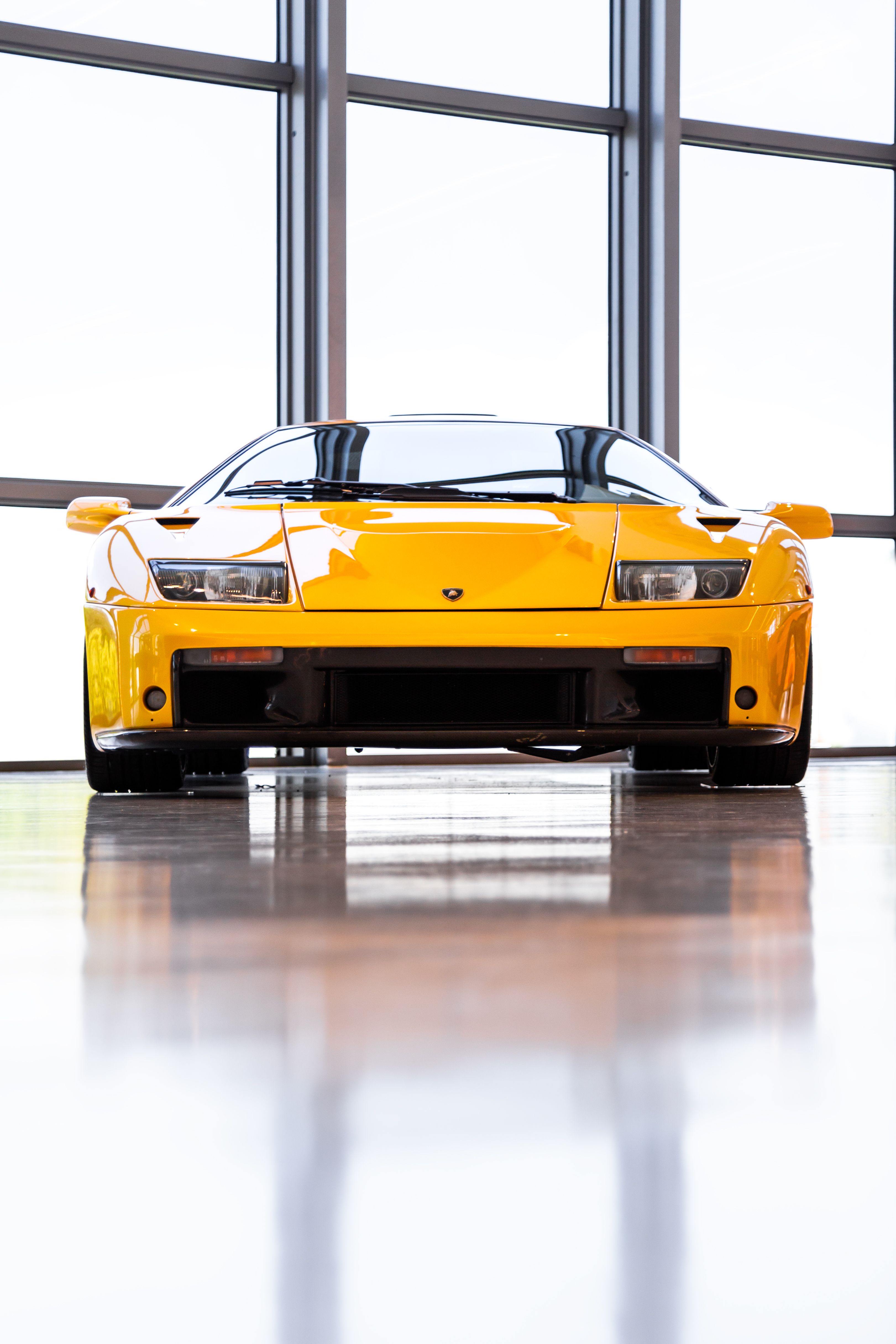 Yellow Lamborghini Diablo in Modern Showroom · Free Stock Photo