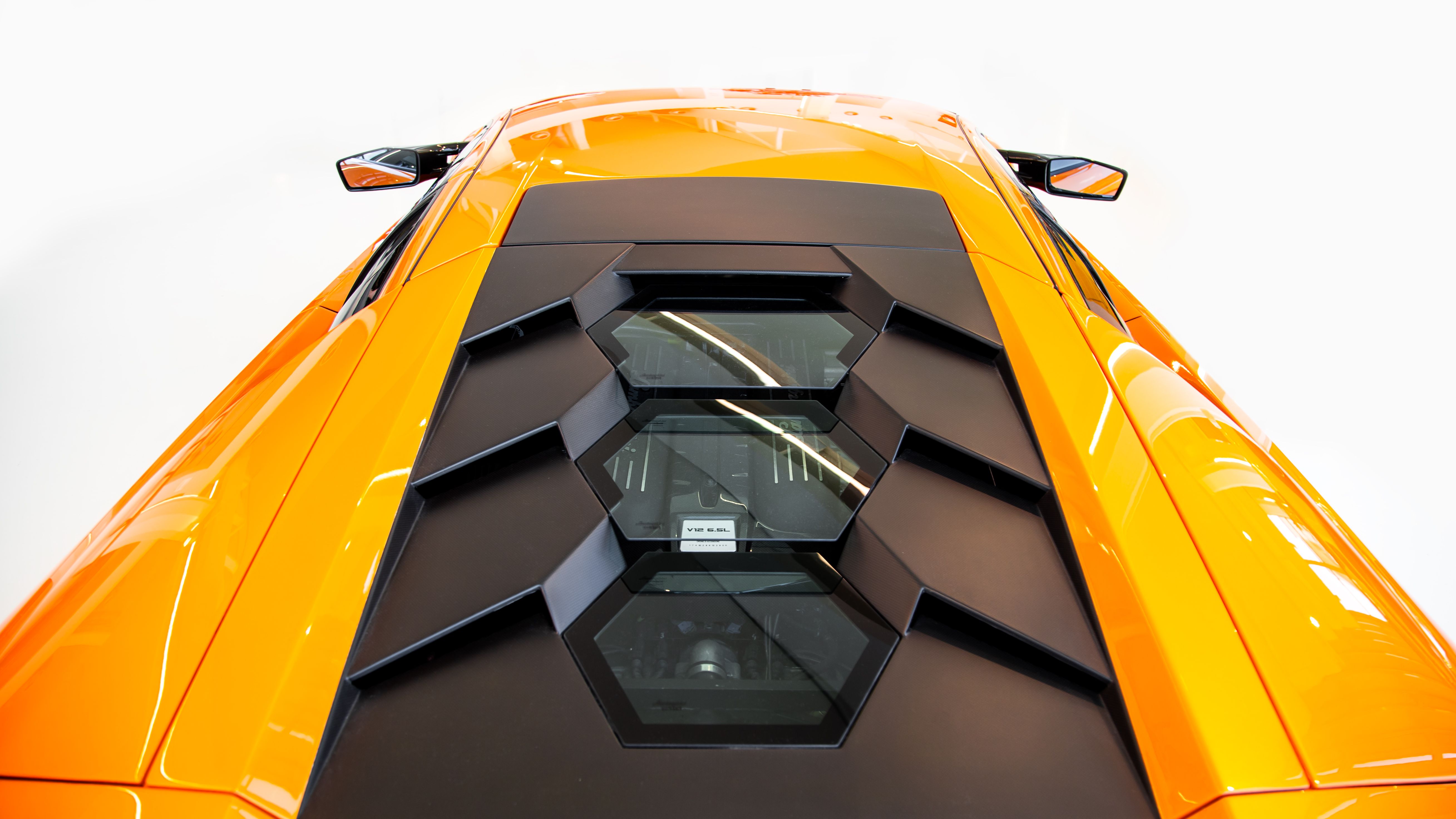 Striking Orange Supercar Engine Detail Close-up · Free Stock Photo