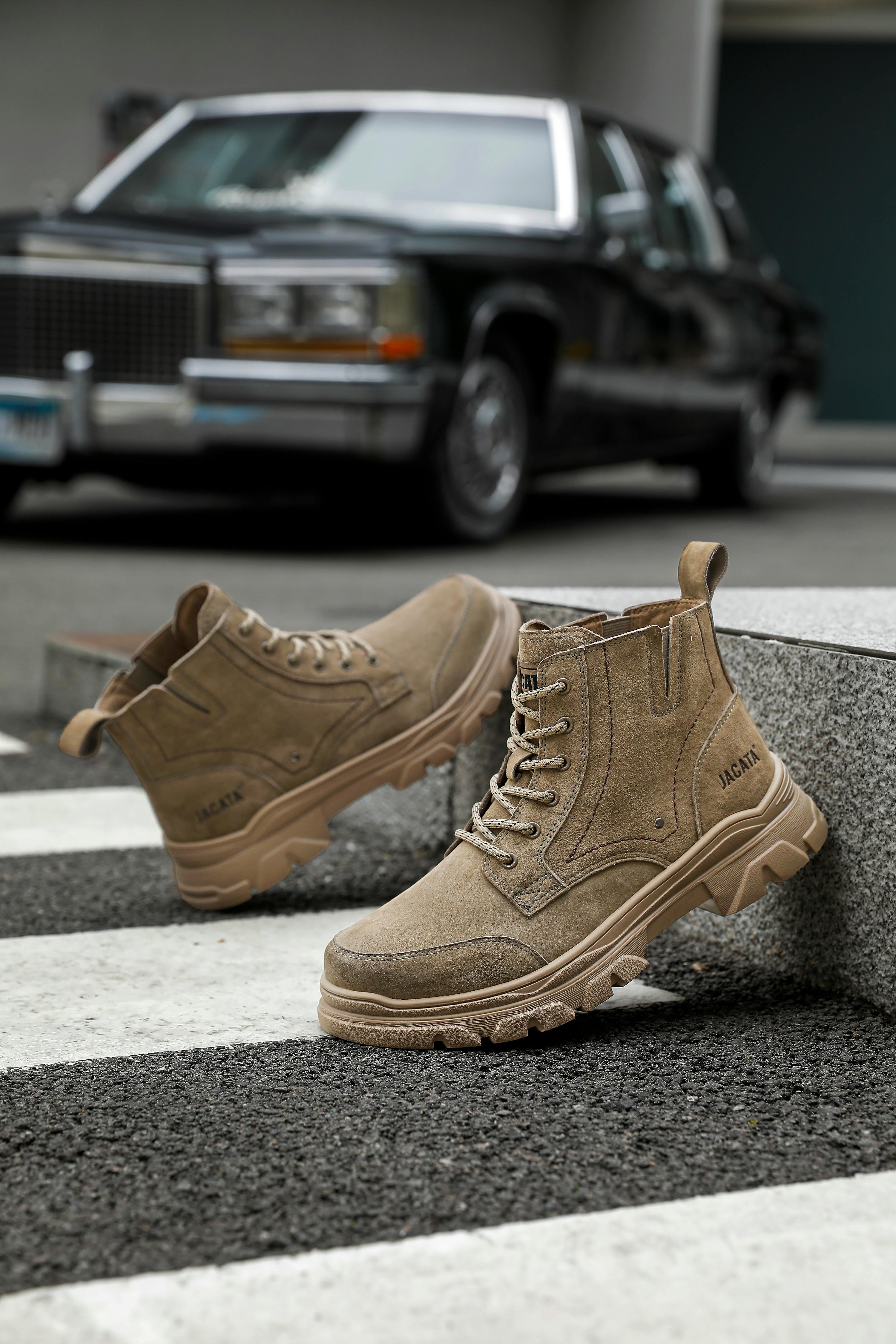 Stylish Tan Boots with Classic Car Backdrop · Free Stock Photo