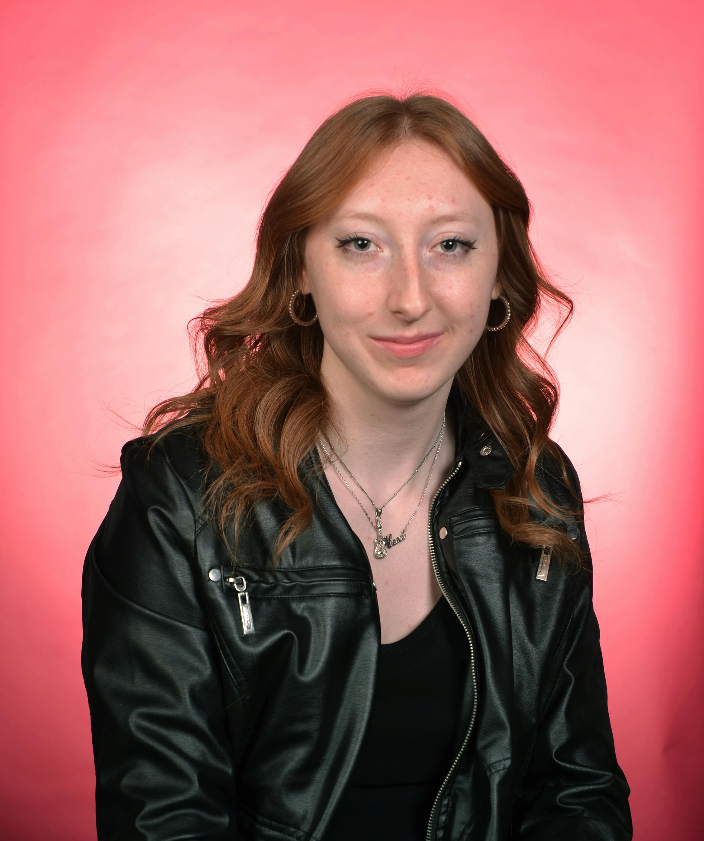 Young Woman in Leather Jacket with Pink Background · Free Stock Photo