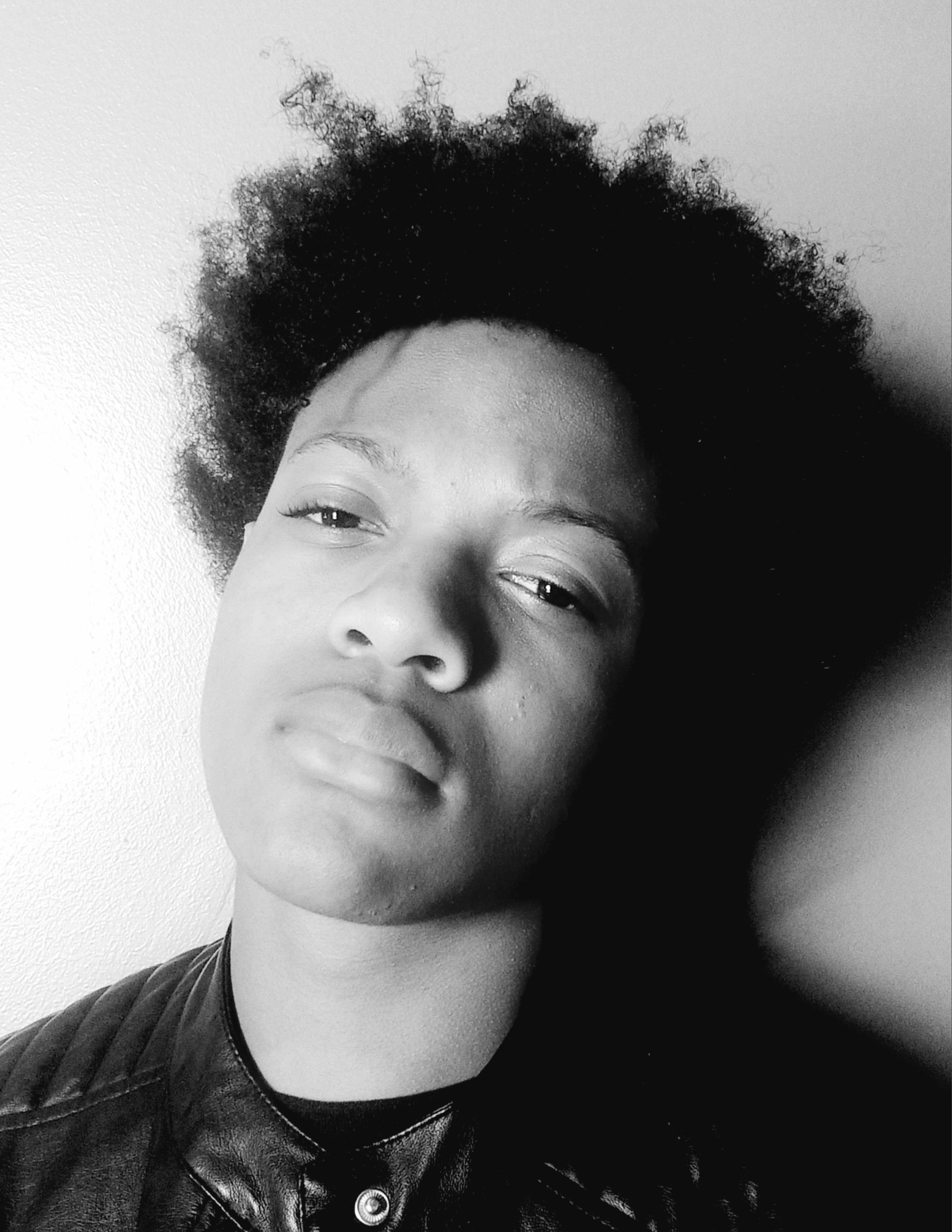 Monochrome Portrait of Teen with Curly Hair · Free Stock Photo