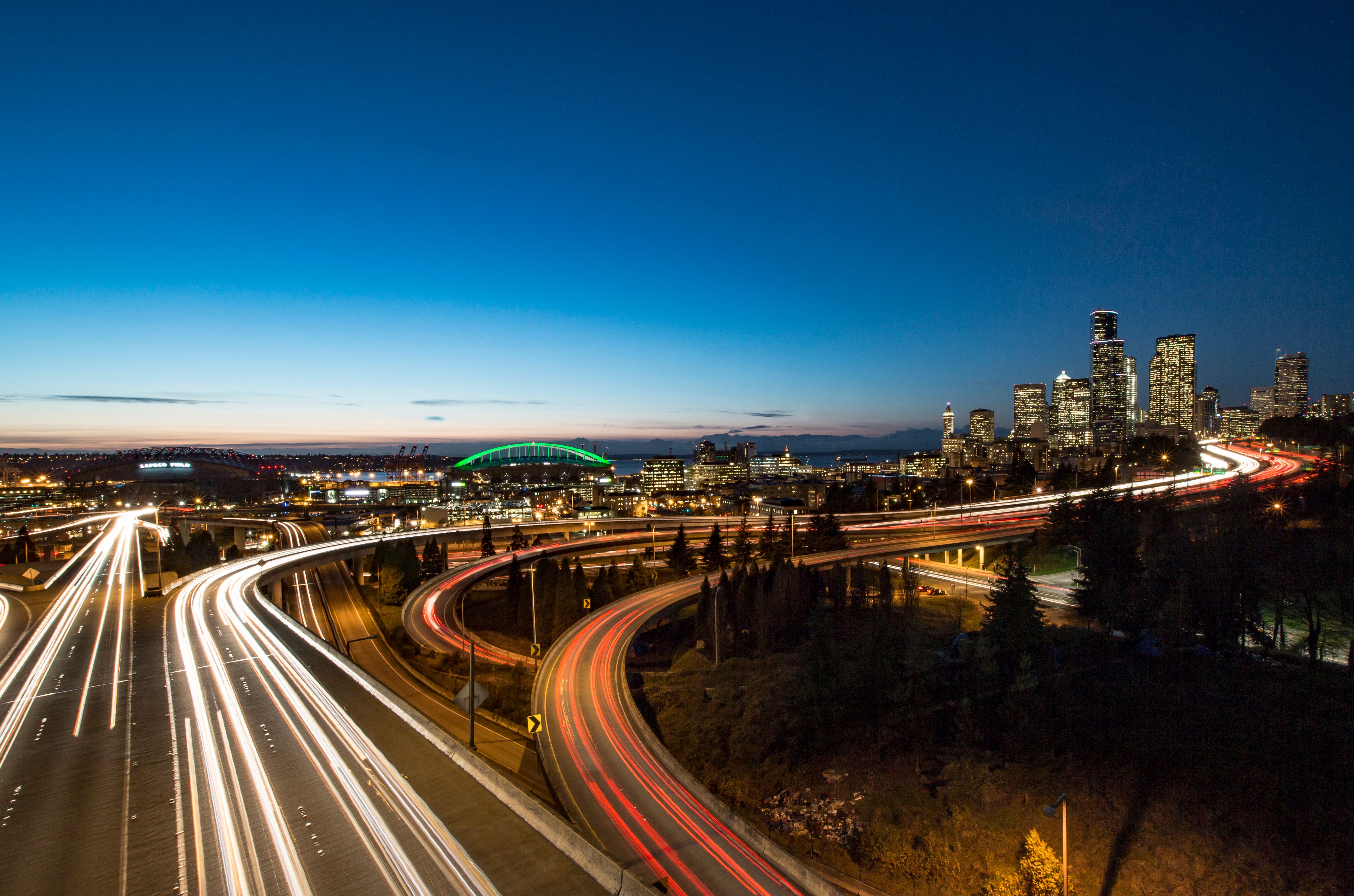 Vibrant Cityscape at Dusk with Light Trails · Free Stock Photo