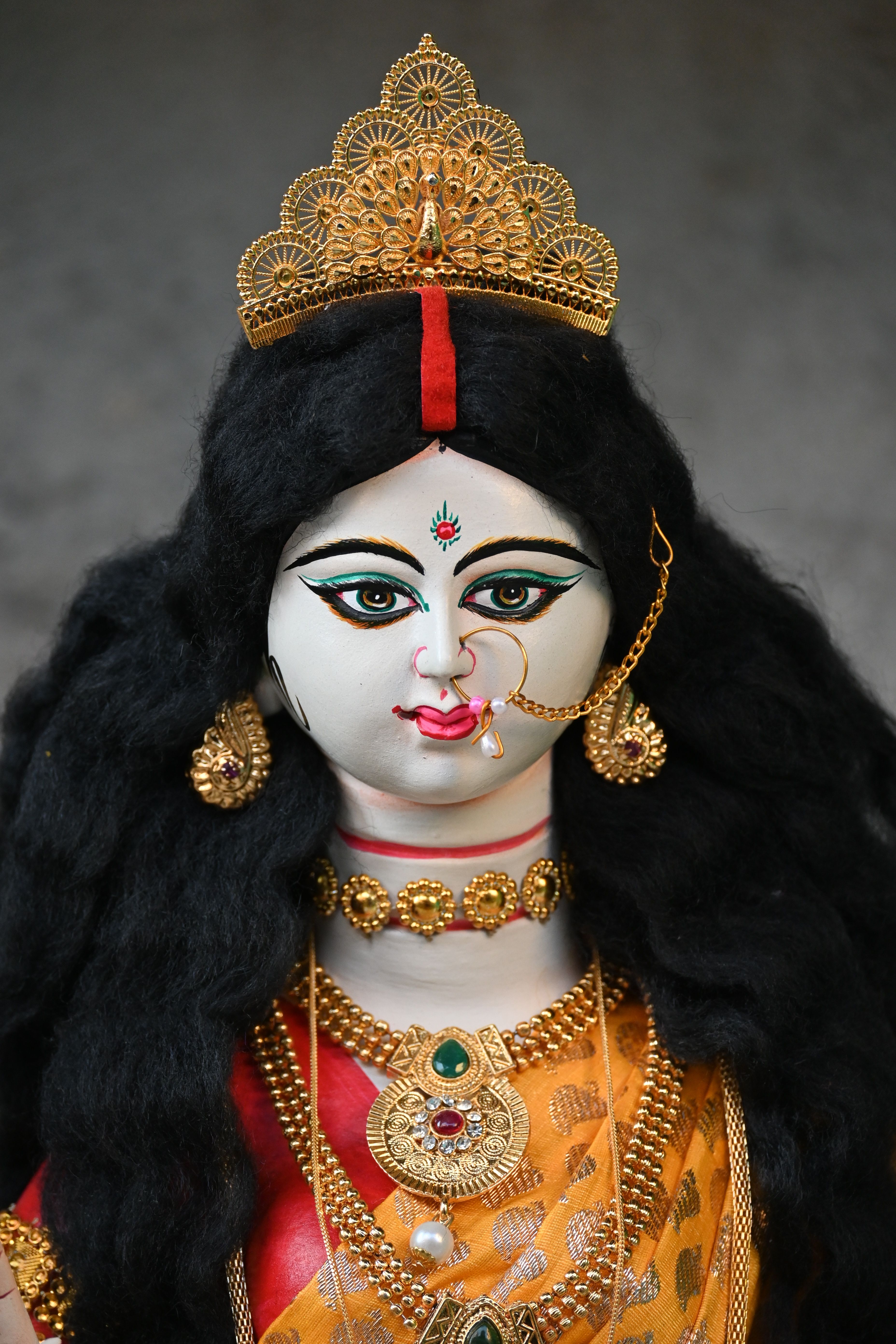 Intricate Goddess Idol With Traditional Jewelry · Free Stock Photo