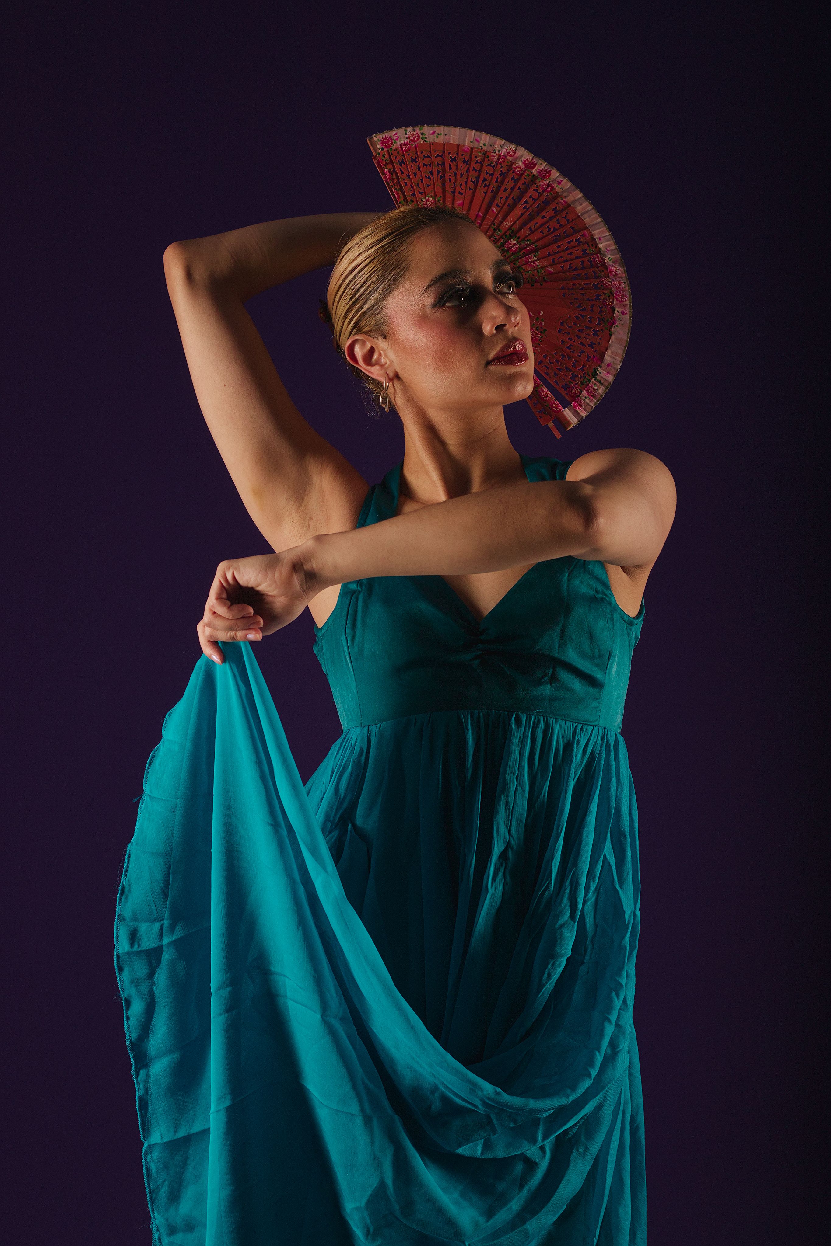 Graceful dancer with fan in vibrant blue dress · Free Stock Photo