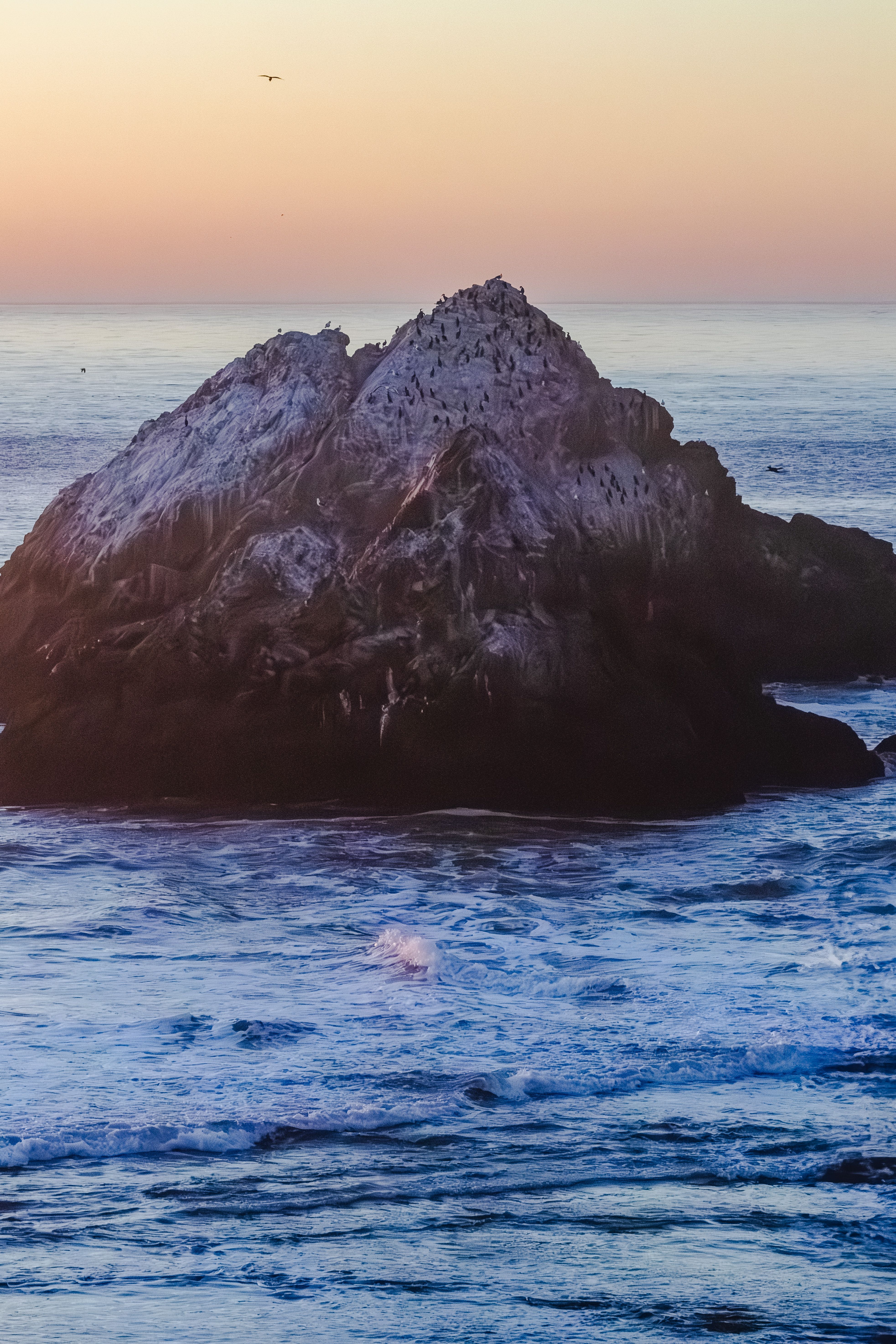 Dramatic Ocean Rock Formation at Sunset · Free Stock Photo