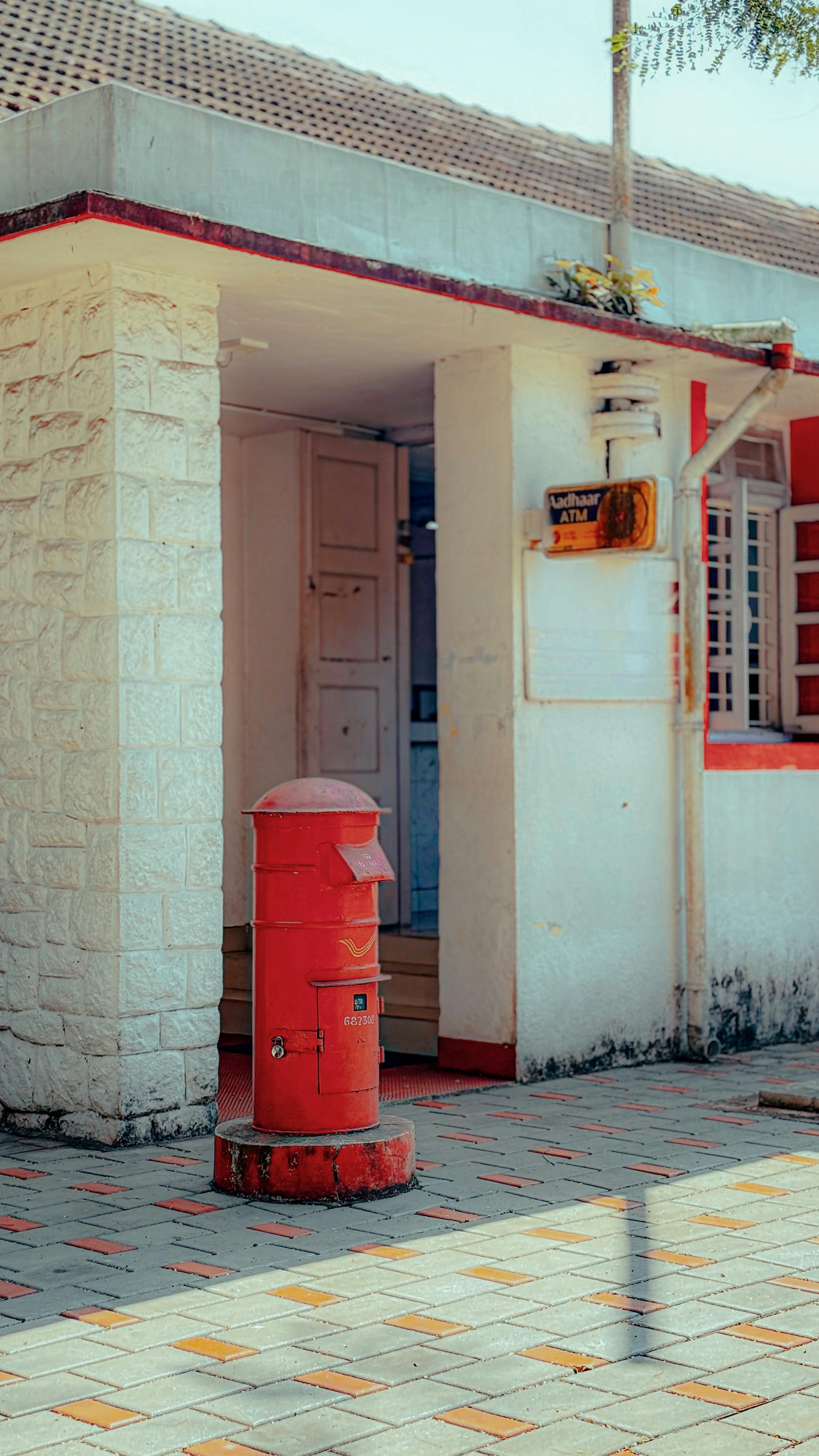 Red Postbox Outside Indian Building in Kerala · Free Stock Photo